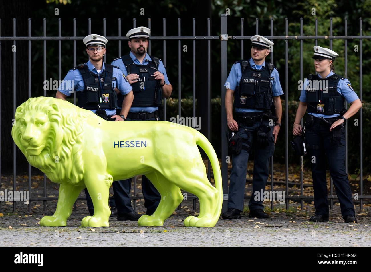 13 October 2023, Hesse, Frankfurt/Main: Police officers stand behind a ...