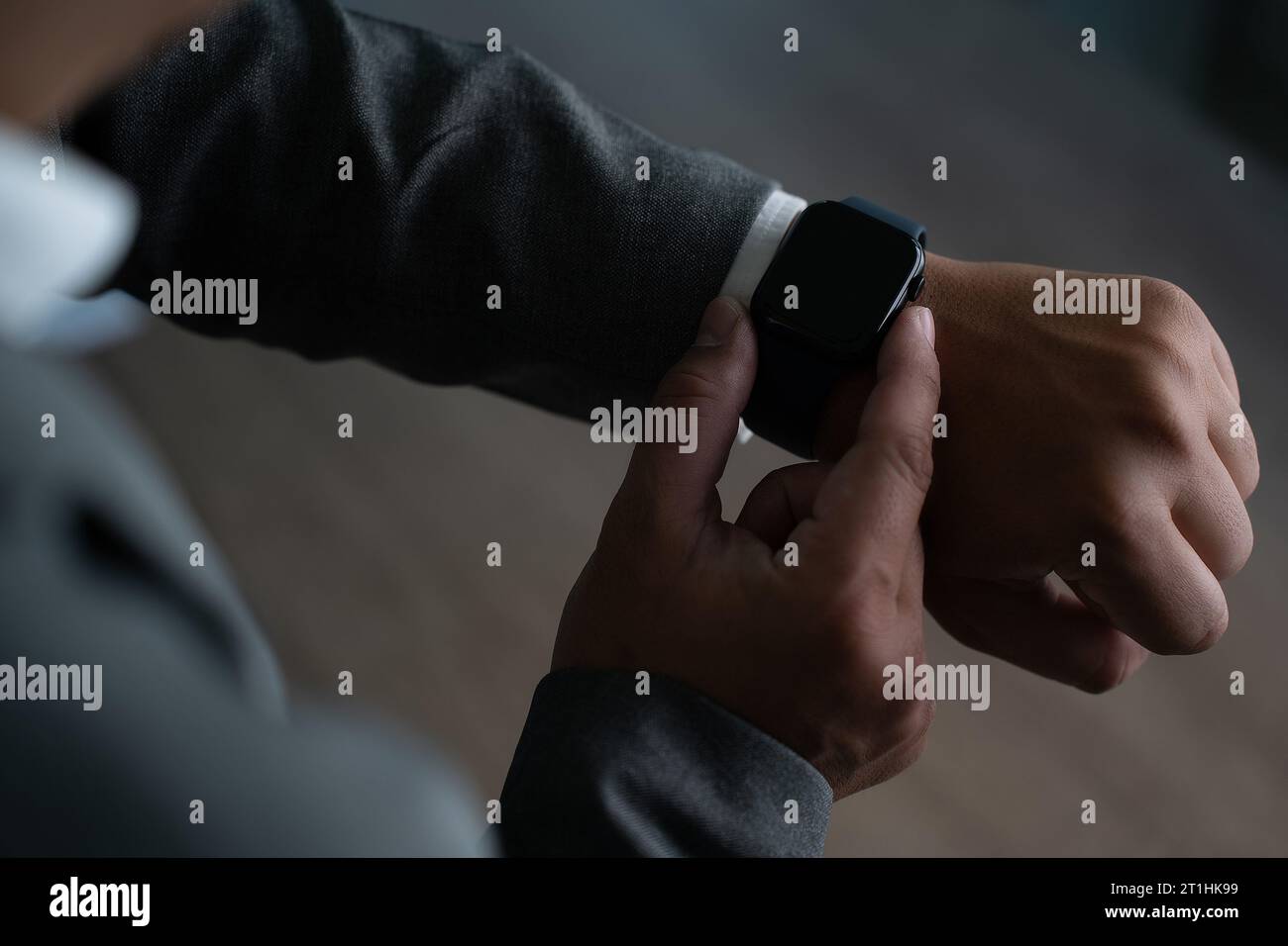 Man checking time on his smartwatch device Close-up display clock ...