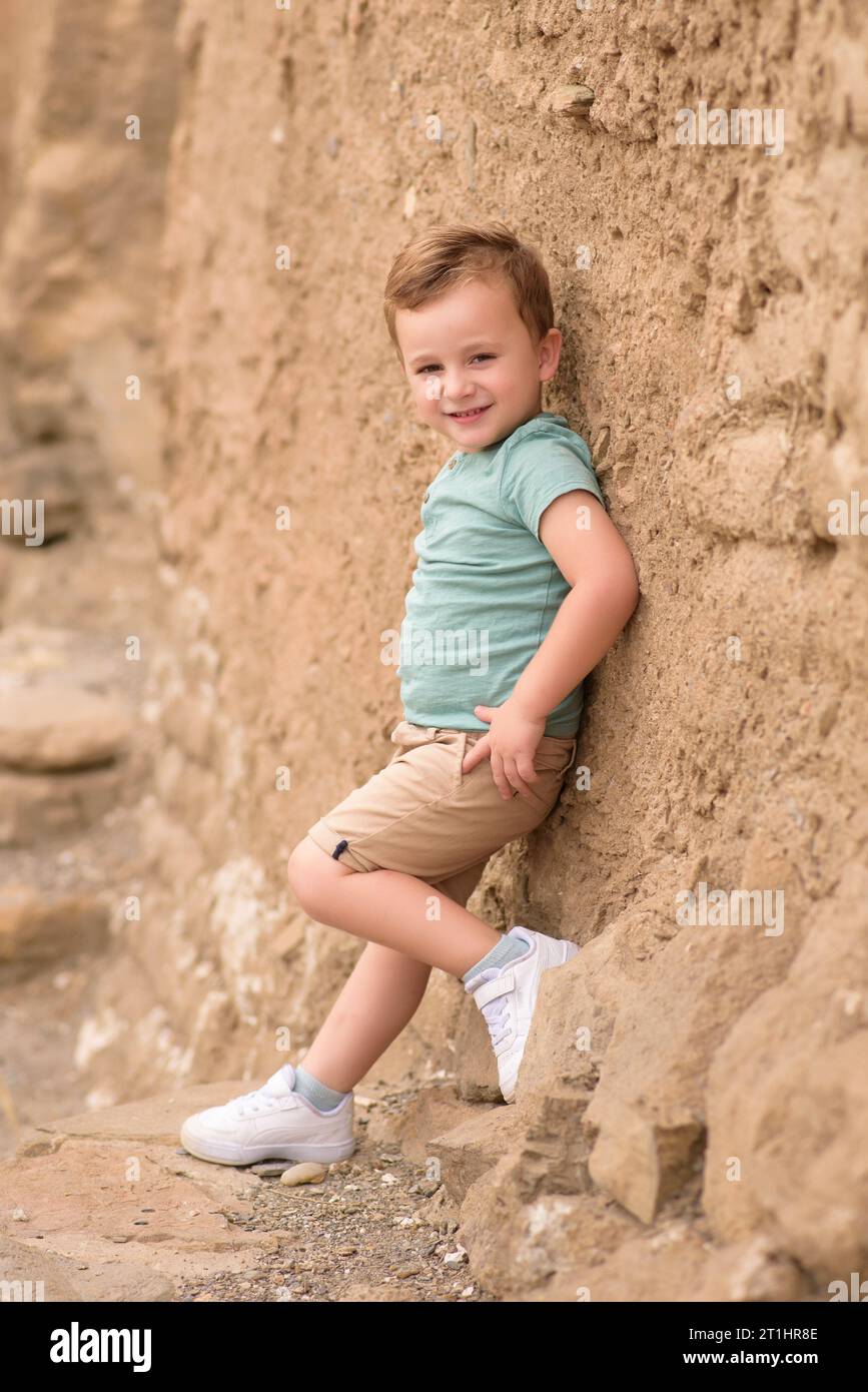 Smiling boy exploring in woods Stock Photo - Alamy