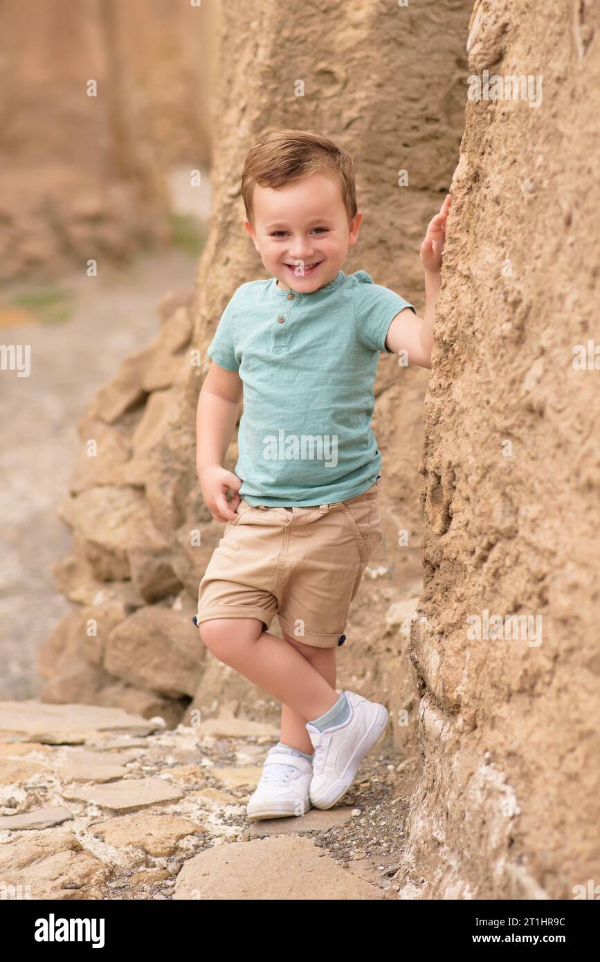 Smiling boy exploring in woods Stock Photo - Alamy
