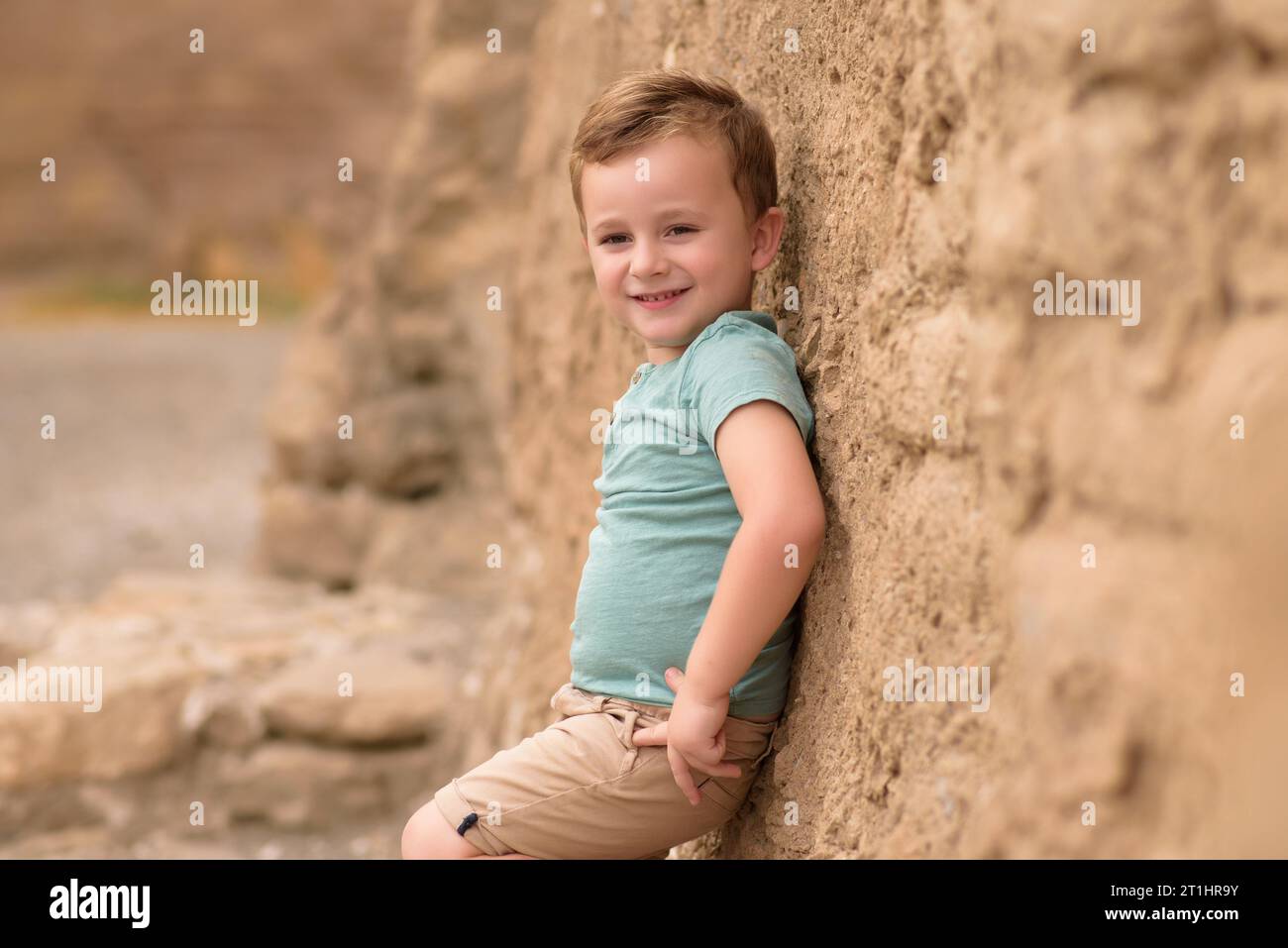 Smiling boy exploring in woods Stock Photo - Alamy