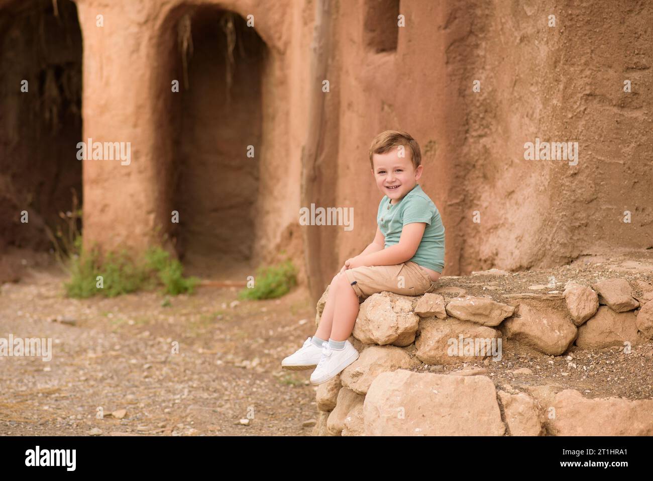 Smiling boy exploring in woods Stock Photo - Alamy