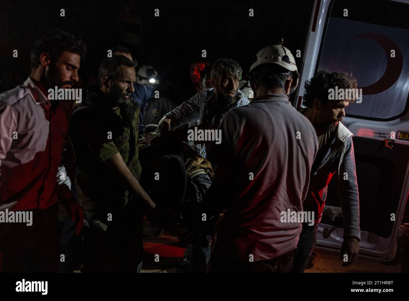 Arihah, Syria. 14th Oct, 2023. Members of the Syrian Civil Defense ...