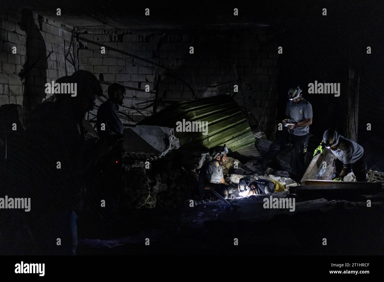 Arihah, Syria. 14th Oct, 2023. Members of the Syrian Civil Defense ...