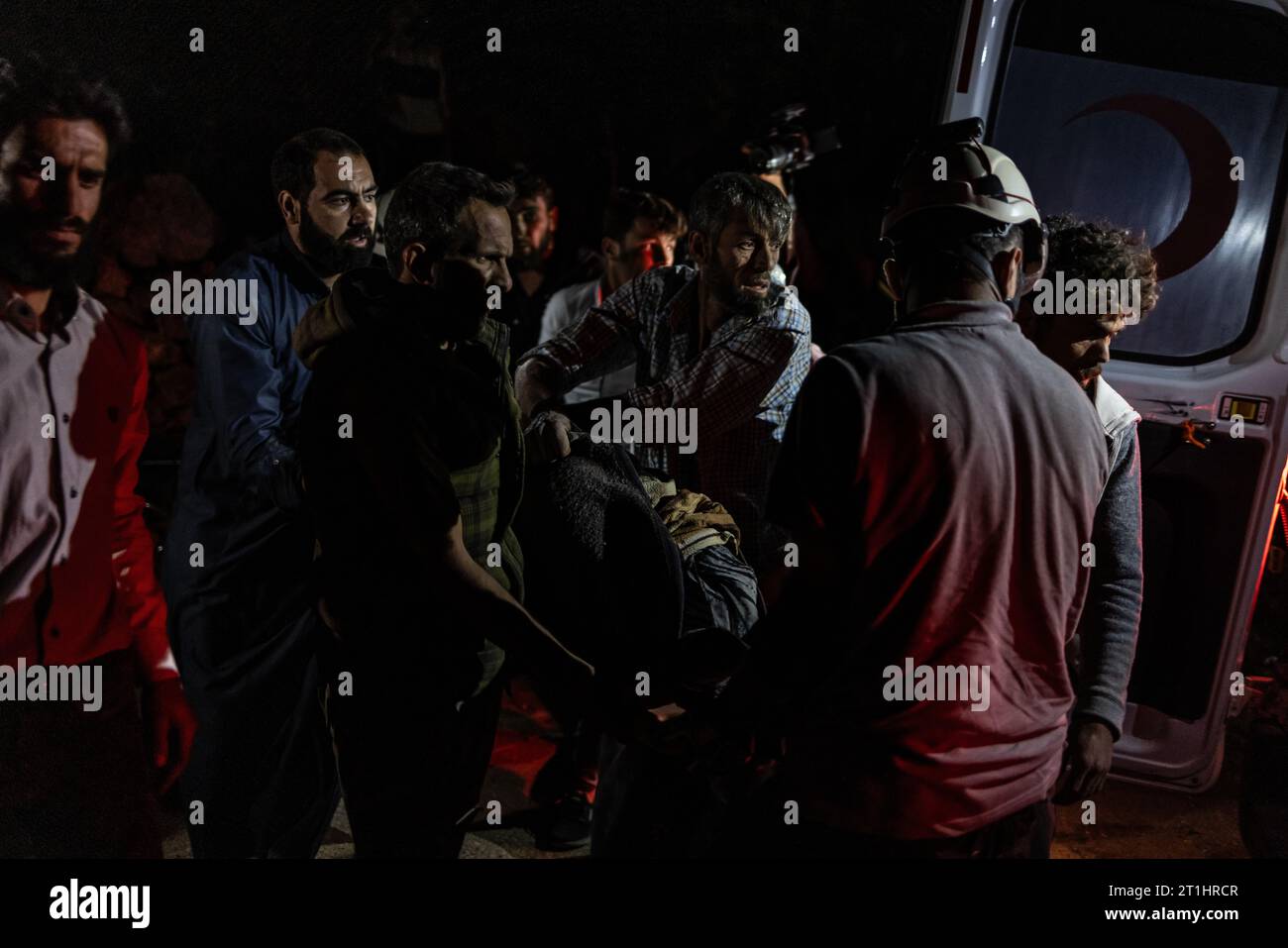 Arihah, Syria. 14th Oct, 2023. Members of the Syrian Civil Defense ...