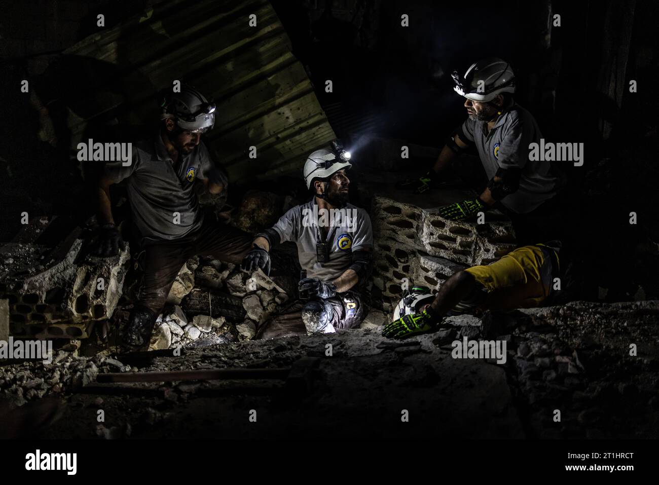 Arihah, Syria. 14th Oct, 2023. Members of the Syrian Civil Defense ...