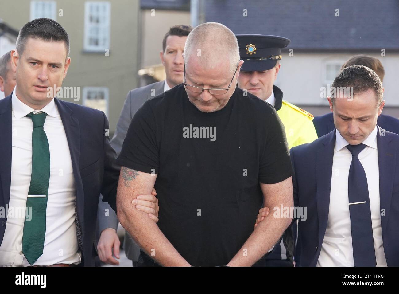 Richard Satchwell (centre) arrives at the District Court in Cashel, Co Tipperary, charged in ...