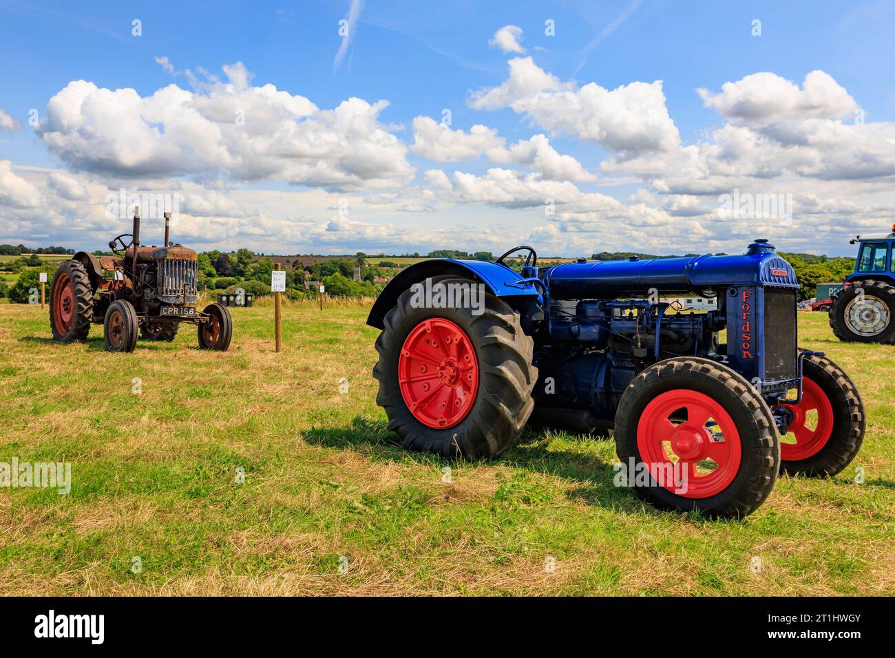 An unrestored Fordson Major E27N behind a restored Fordson tractor at the 2023 Low Ham Steam ...