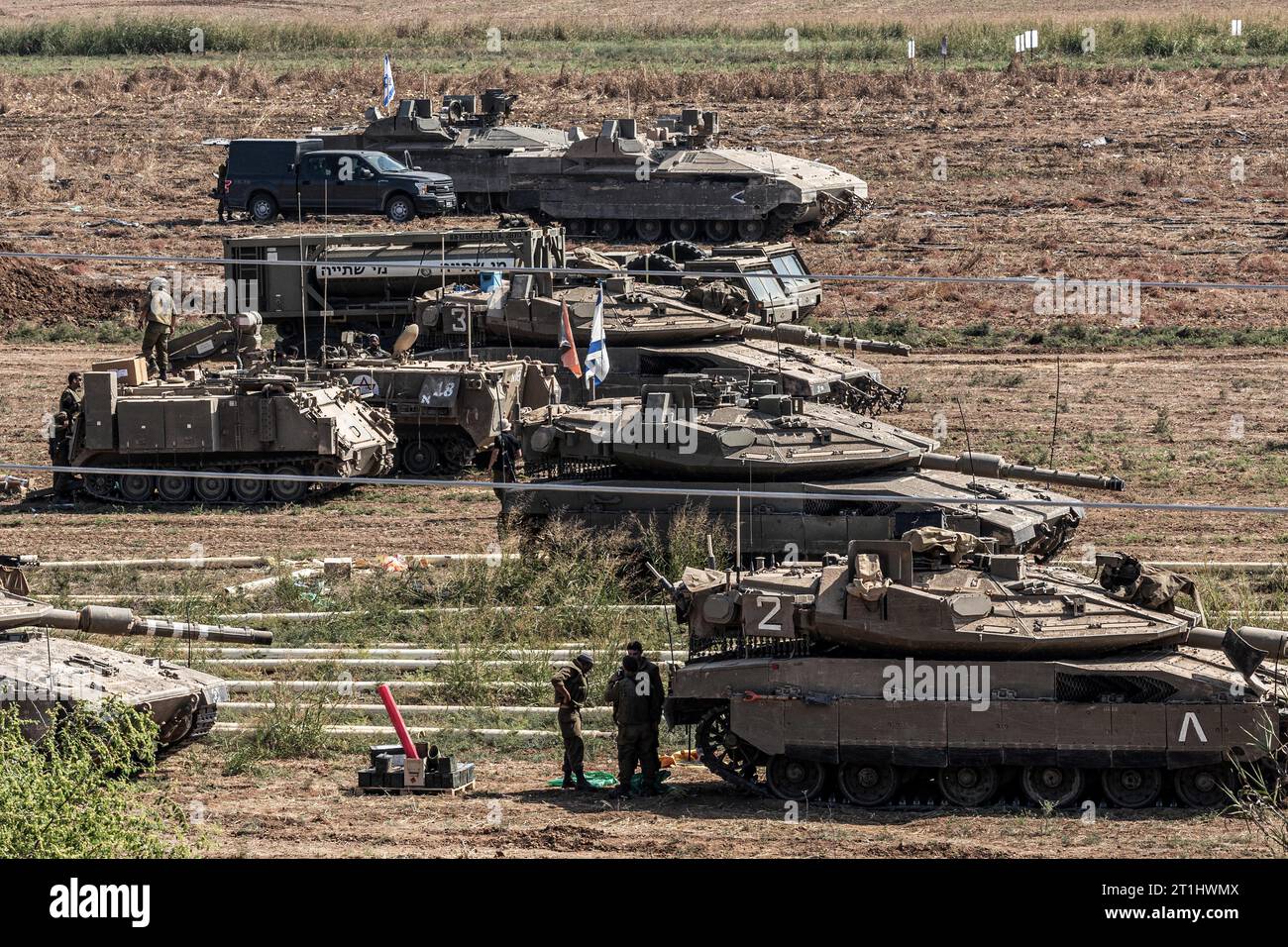 Zikim, Israel. 14th Oct, 2023. Israeli tanks and soldiers are seen at a ...