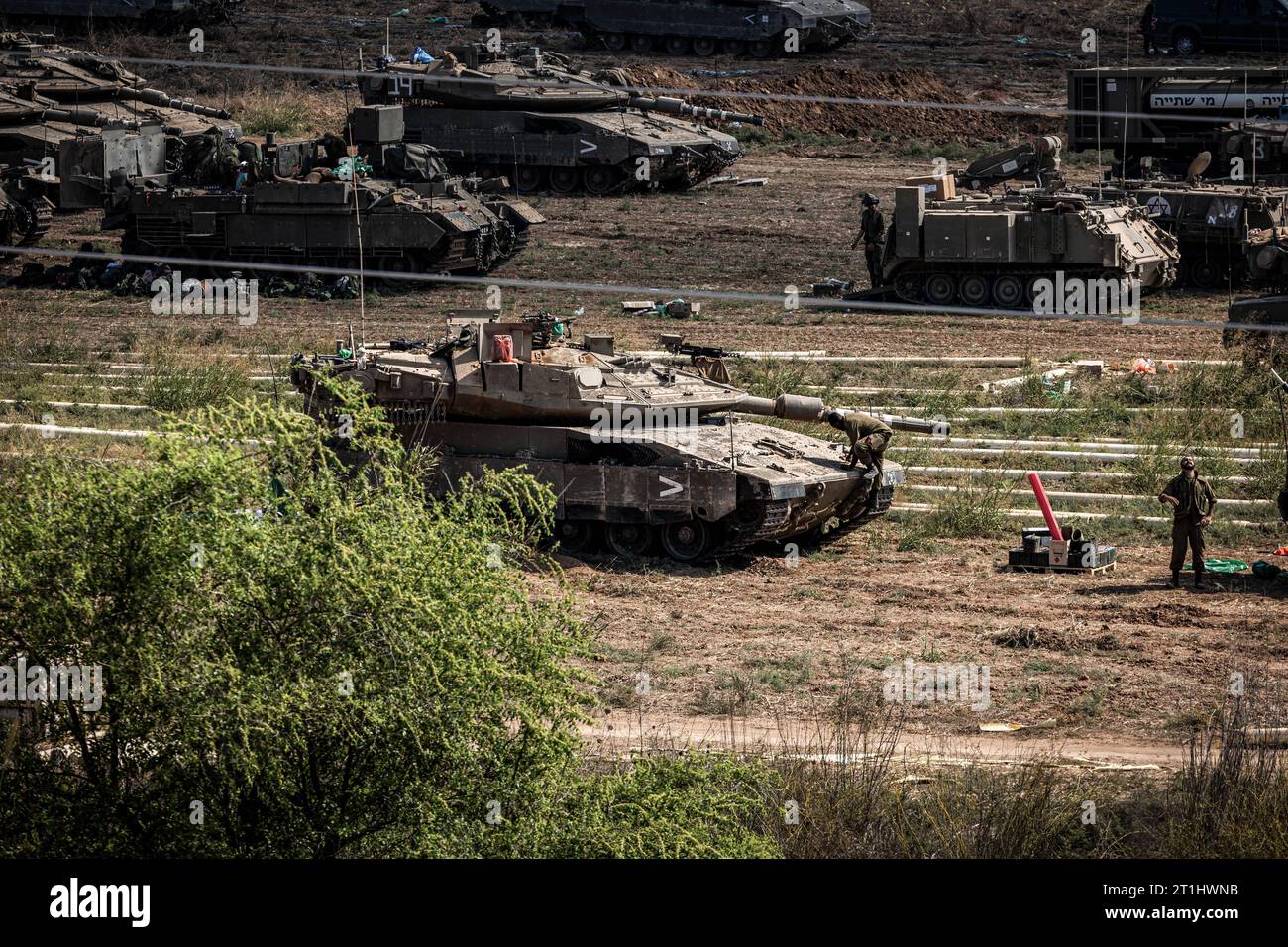 Zikim, Israel. 14th Oct, 2023. Israeli tanks and soldiers are seen at a ...