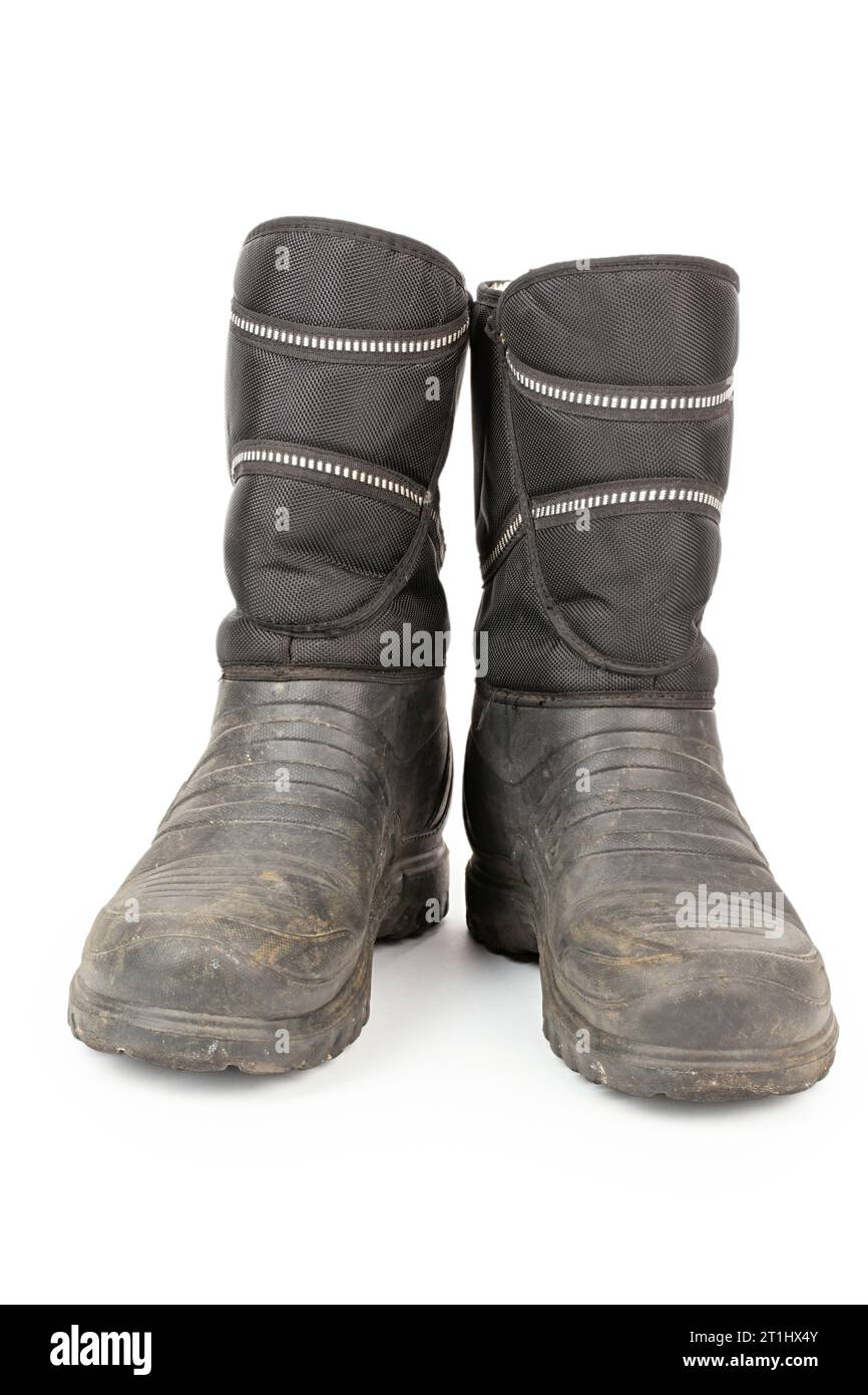 Dirty insulated old boots on a white background. Hiking boots. File ...