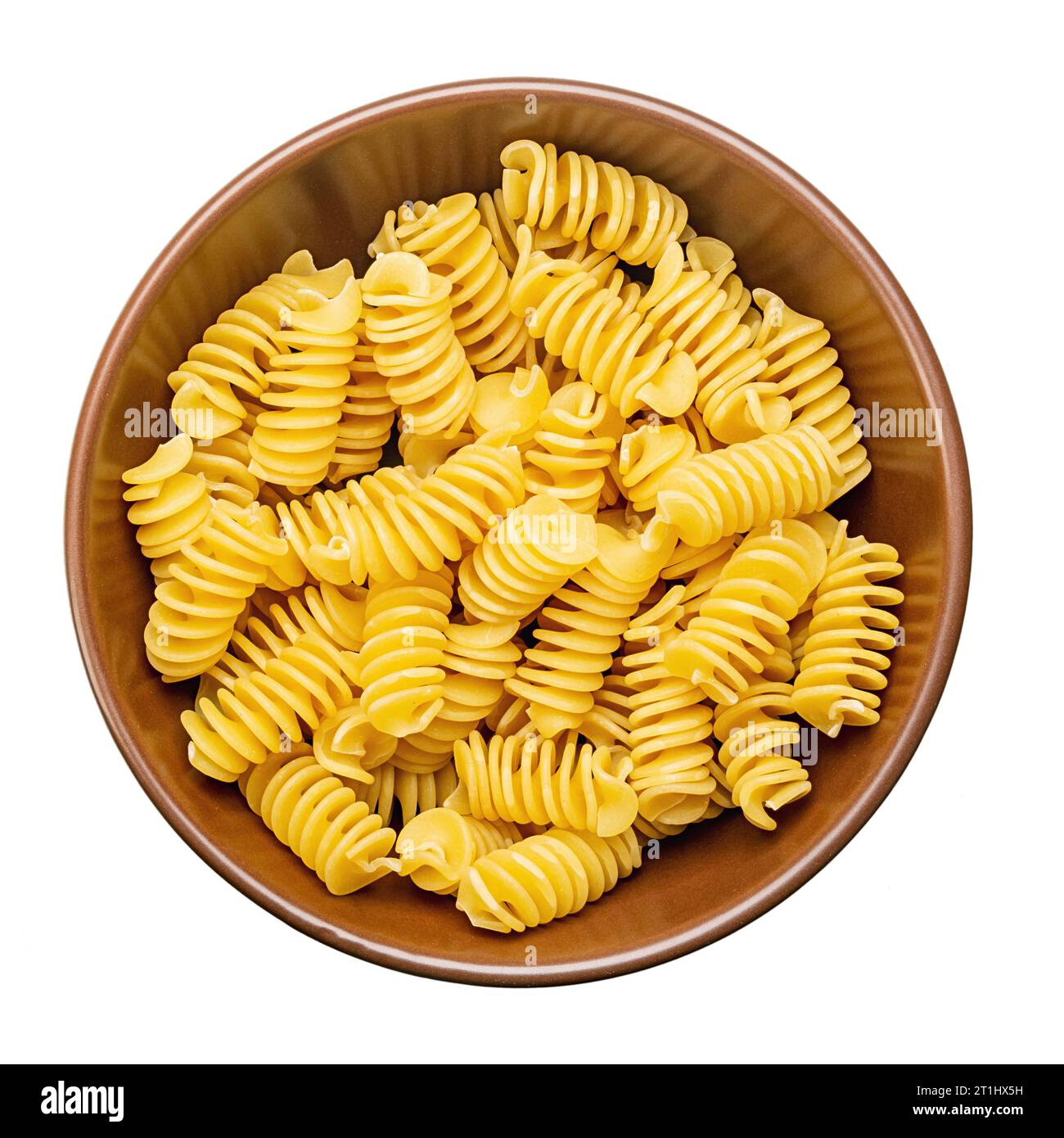 Pasta close-up. Fusilli spirale in a bowl, isolated on white background ...