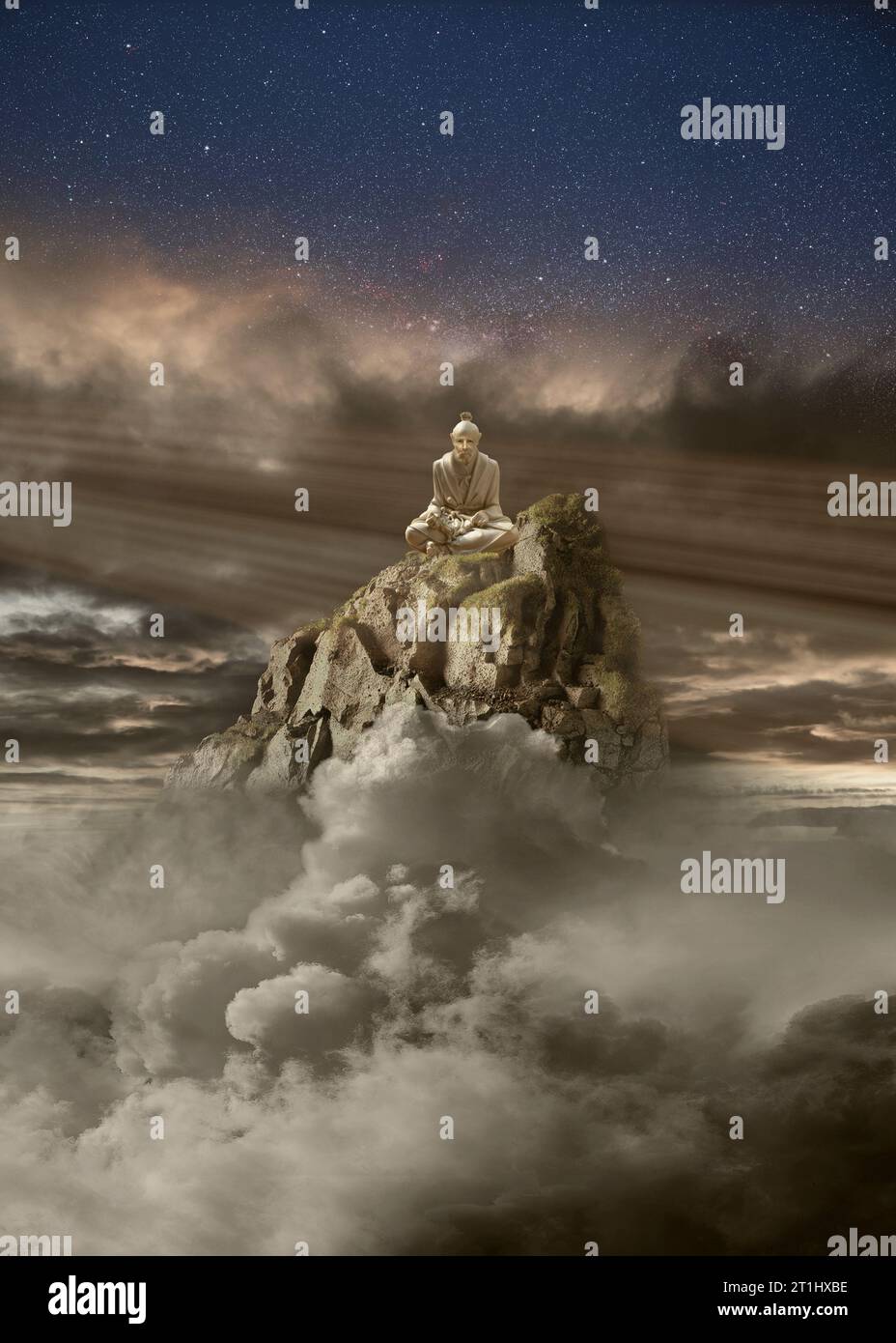 Meditating monk on top of mountain Stock Photo - Alamy
