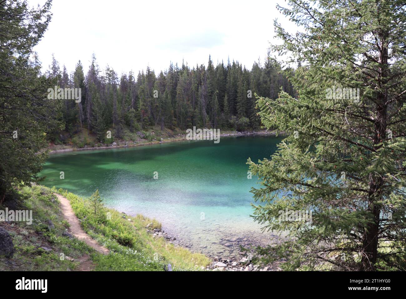 First glimpse of golden sunrise at Pyramid Lake in Jasper National Park ...