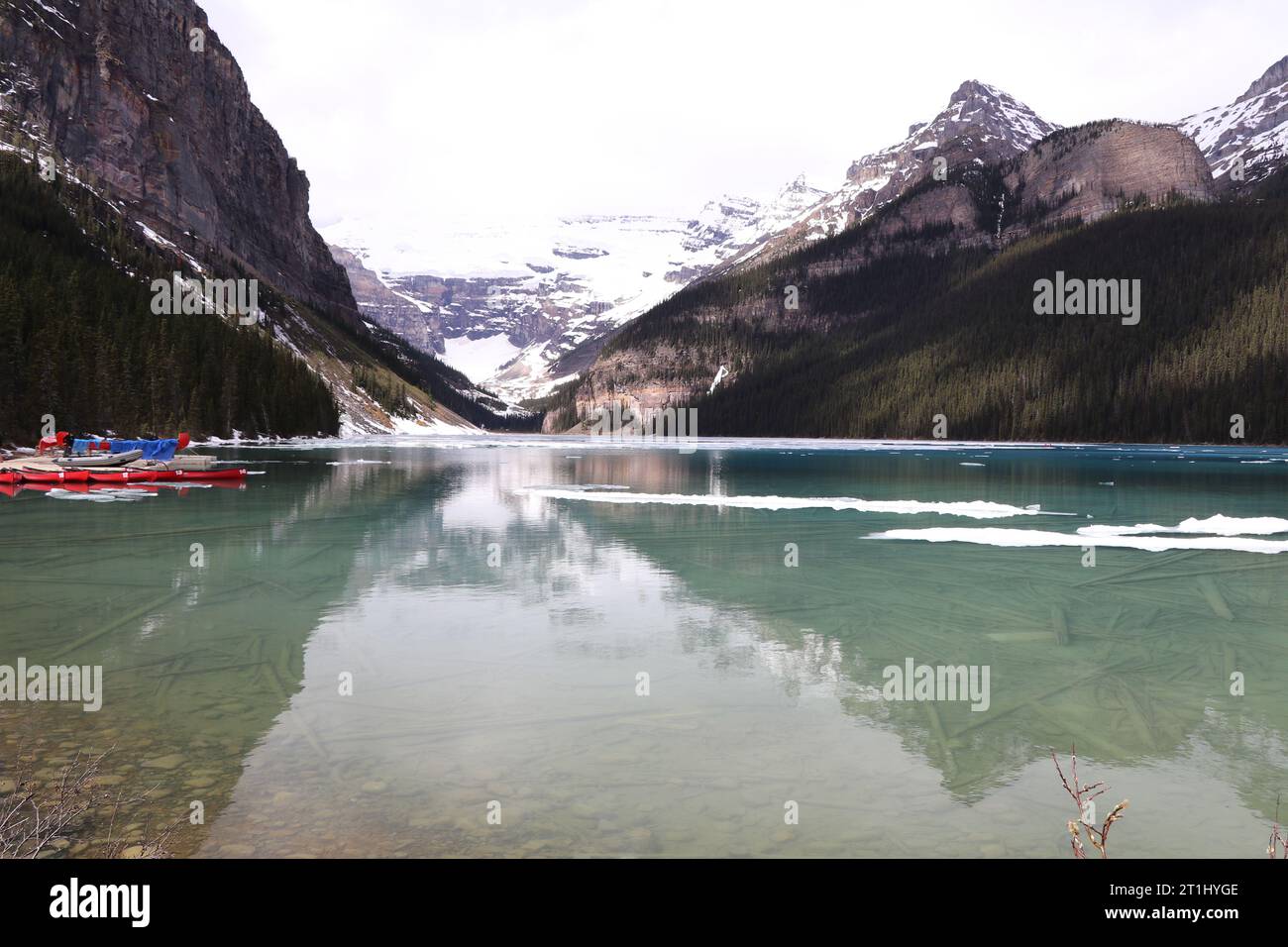 Lake Annette lake shore beach, Pyramid mountain reflection on the lake ...