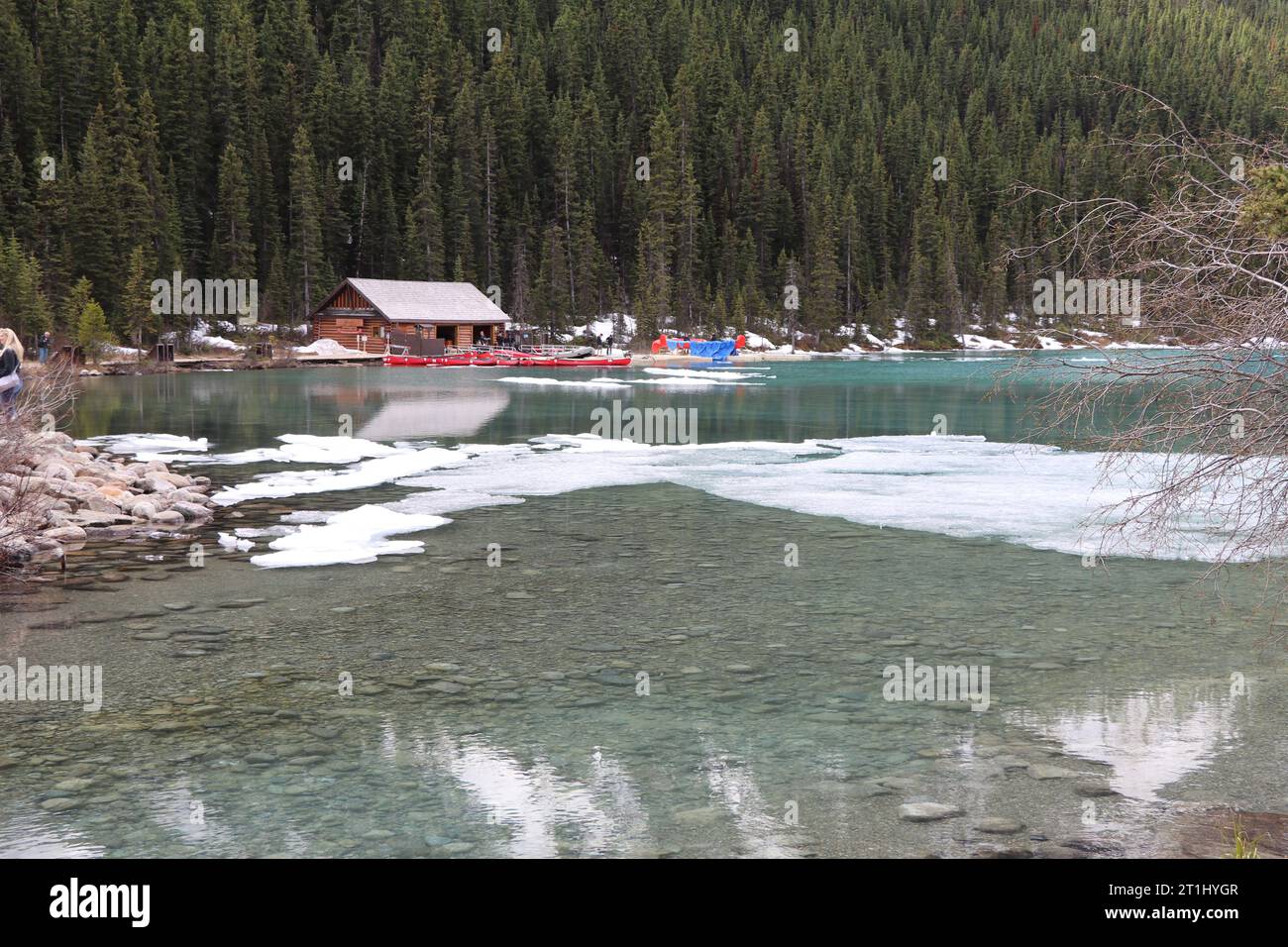 Lake Annette lake shore beach, Pyramid mountain reflection on the lake ...