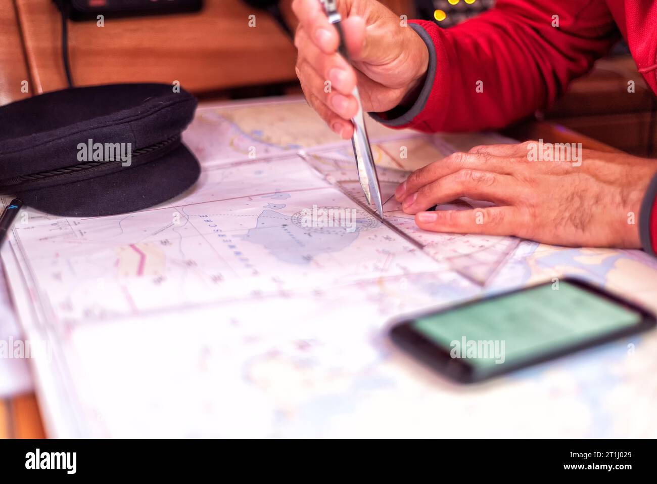 navigation with sea charts in the chart room on a sailing yacht Stock ...