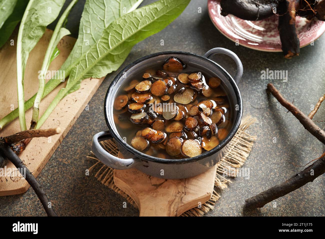 Making homemade knitbone ointment for bones and joints from sliced ...