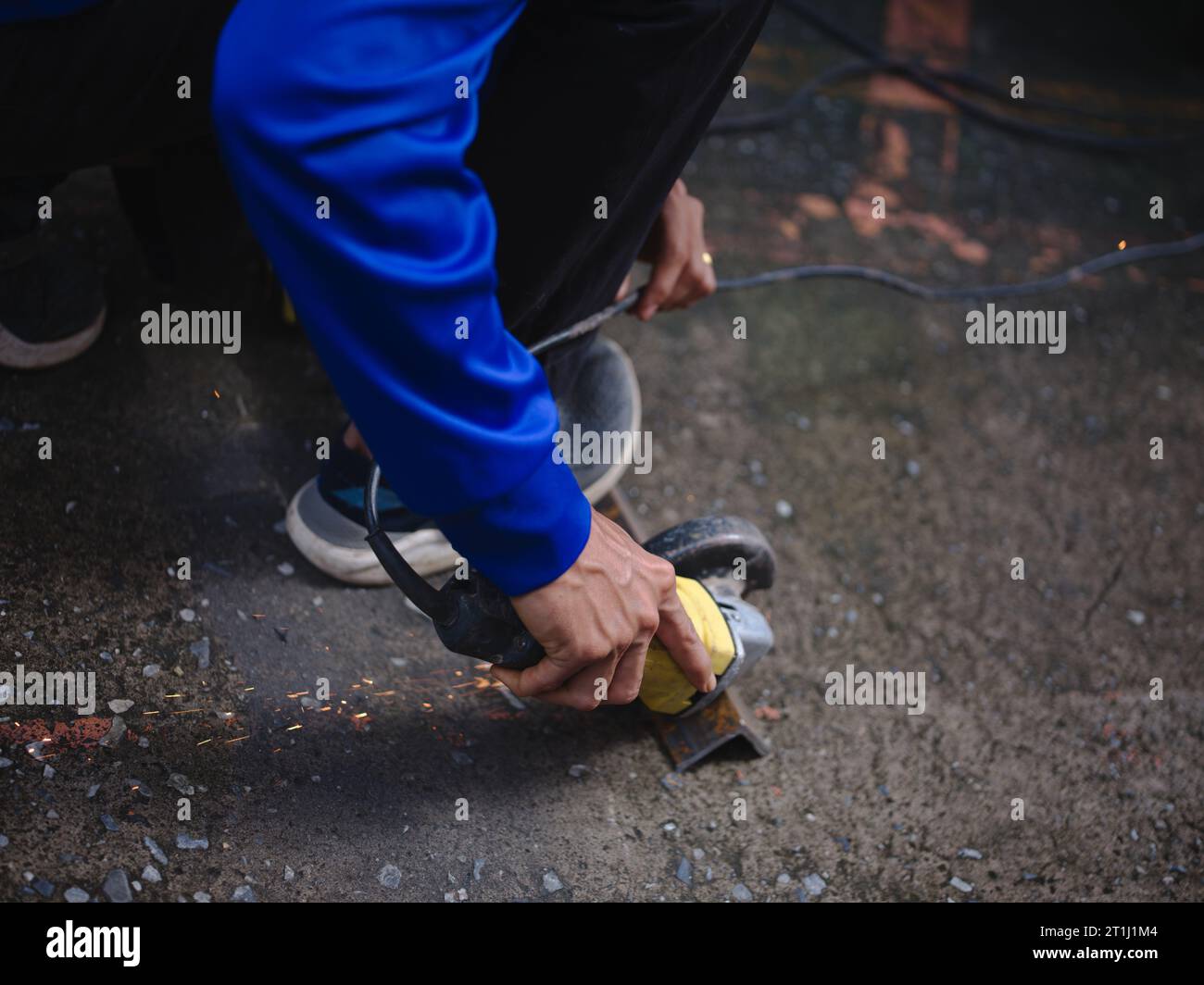 Industrial Worker Using Angle Grinder and Cutting a Metal Stock Photo ...