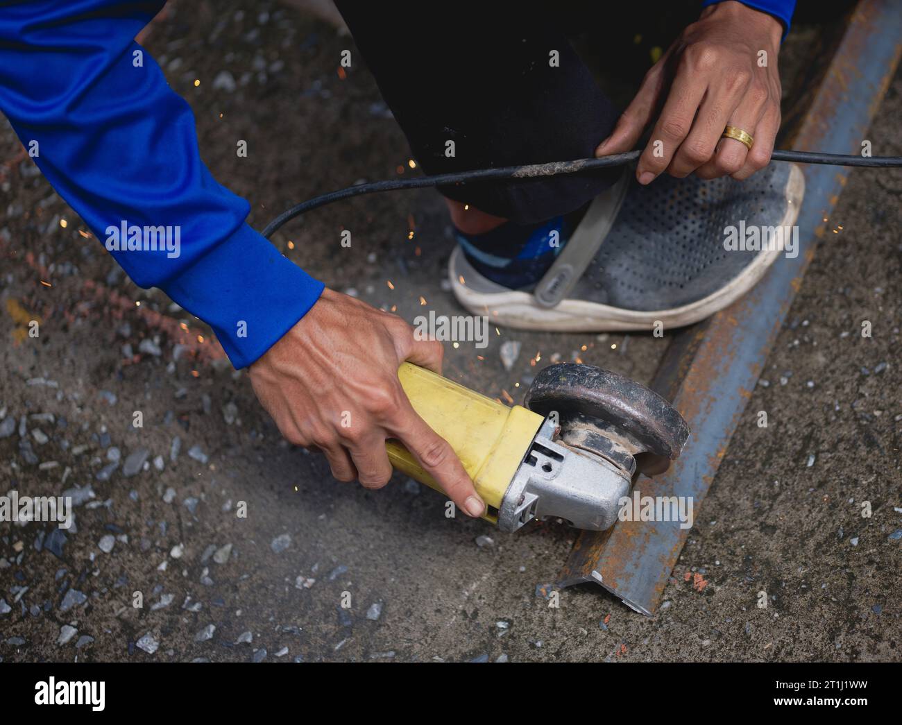 Industrial Worker Using Angle Grinder and Cutting a Metal Stock Photo ...