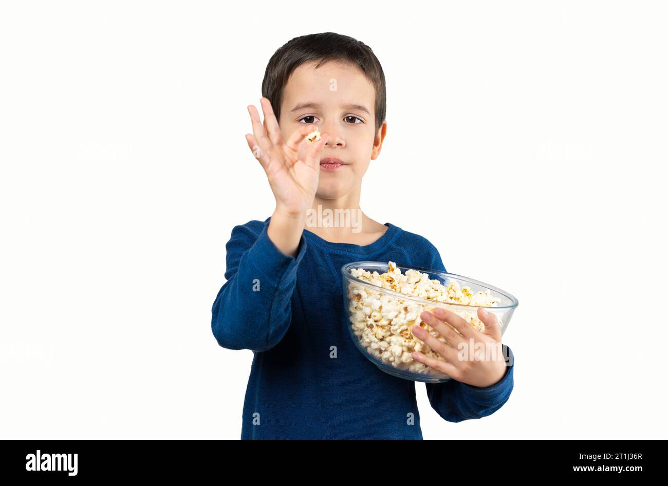 Child eating popcorn snack isolated white background with a happy face ...