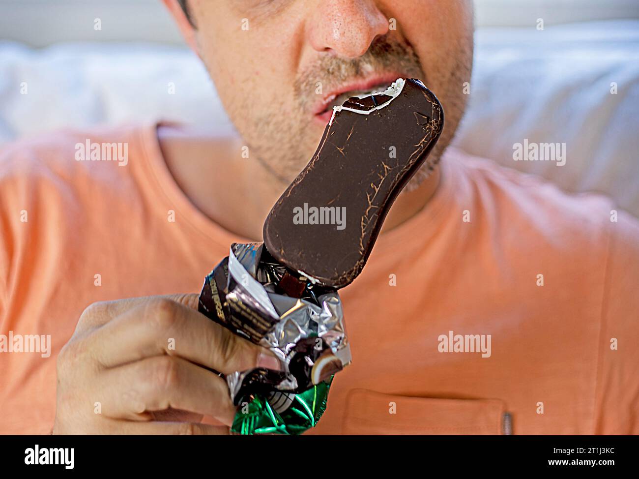 Man eating chocolate hi-res stock photography and images - Alamy