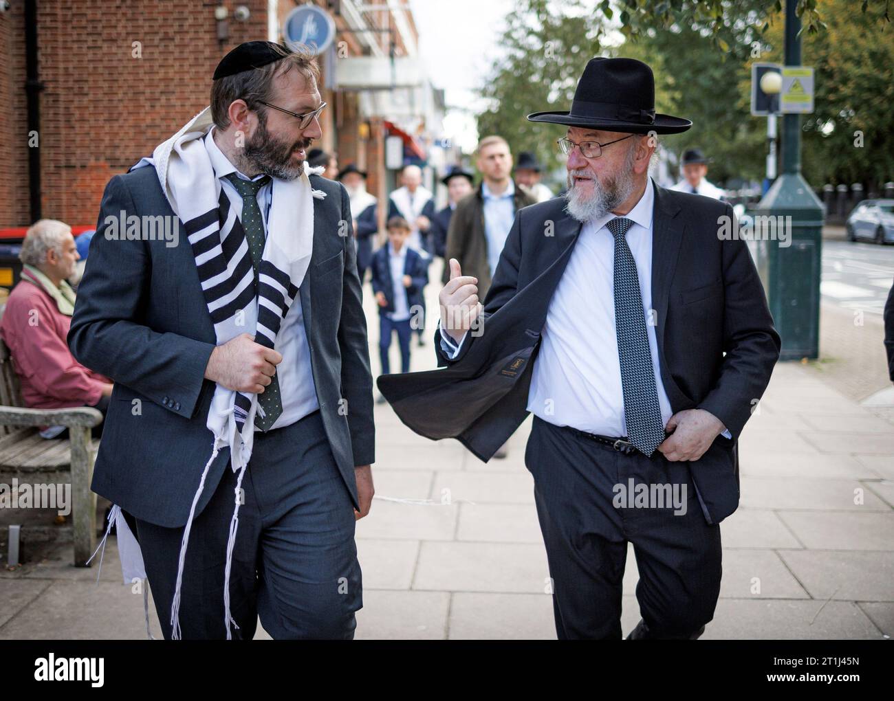 London, UK. 14th Oct, 2023. Chief Rabbi Ephraim Mirvis (right) is seen ...