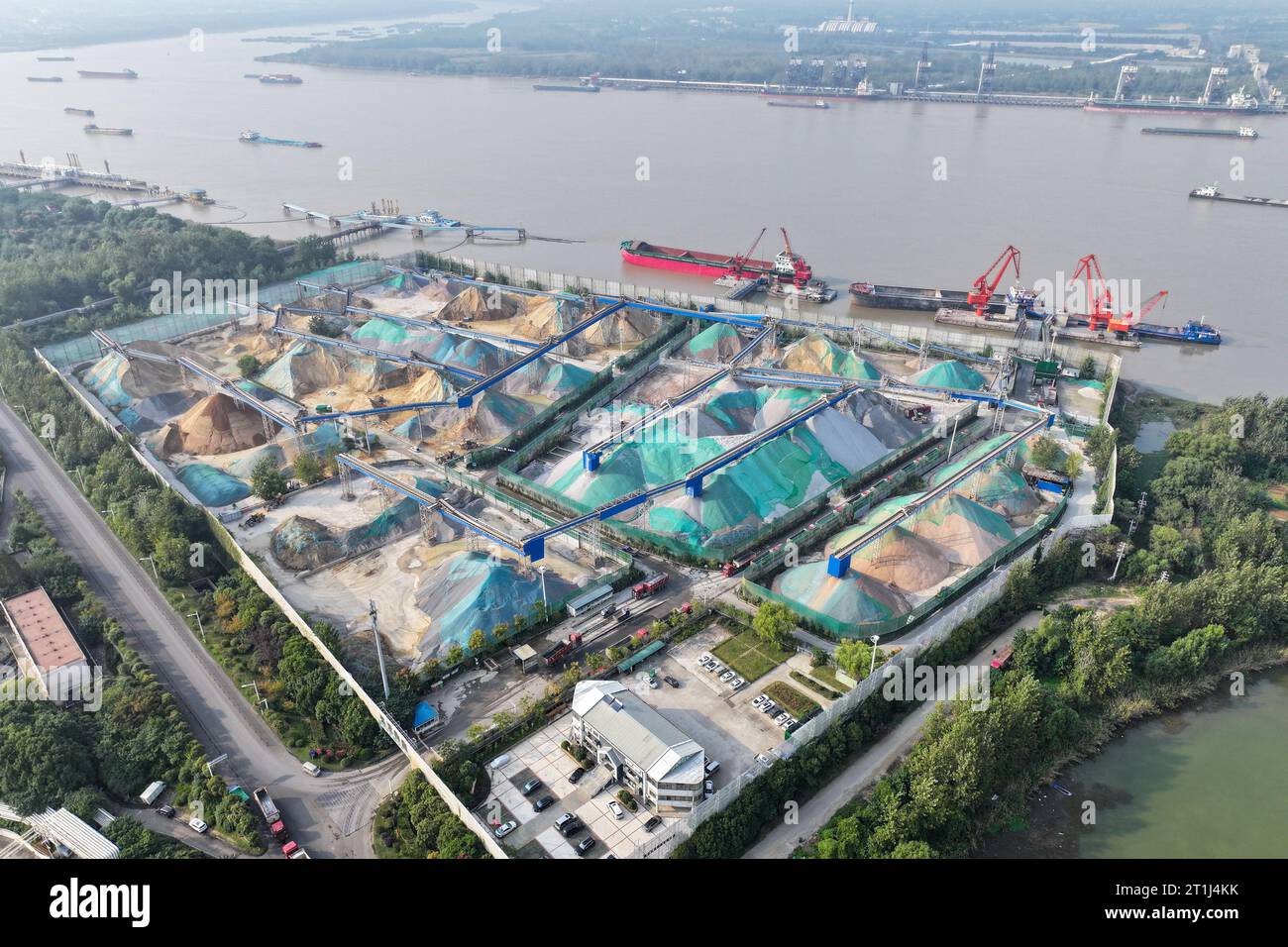 NANJING, CHINA - OCTOBER 14, 2023 - Sand is stored at a sand pier along ...