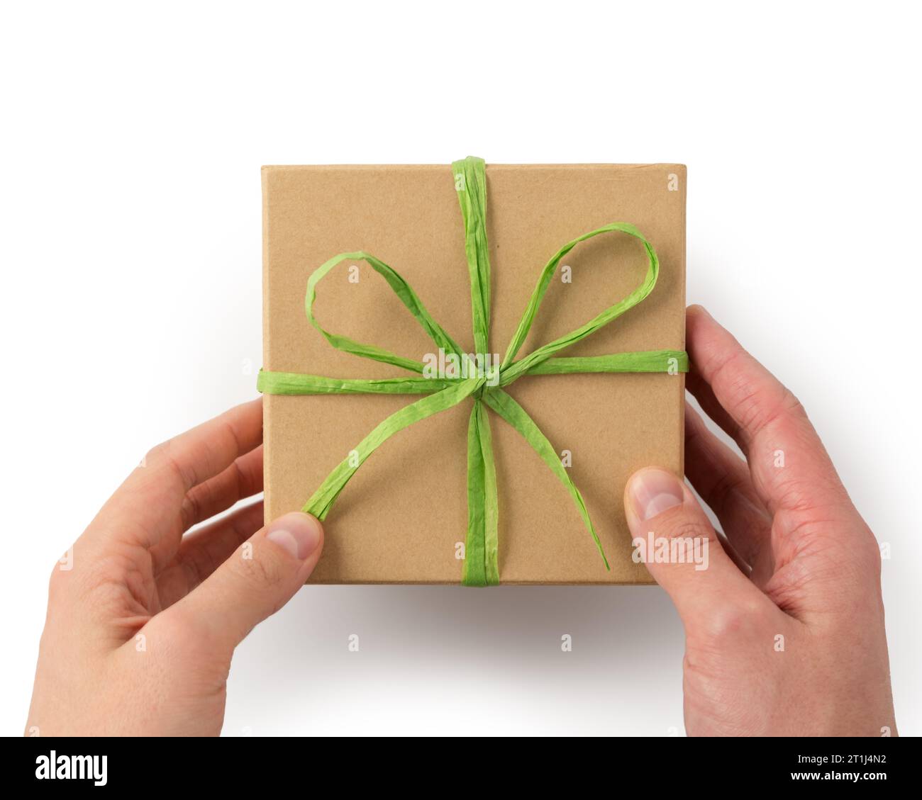 Top view of man hands hold craft cardboard gift box with green recycled ...