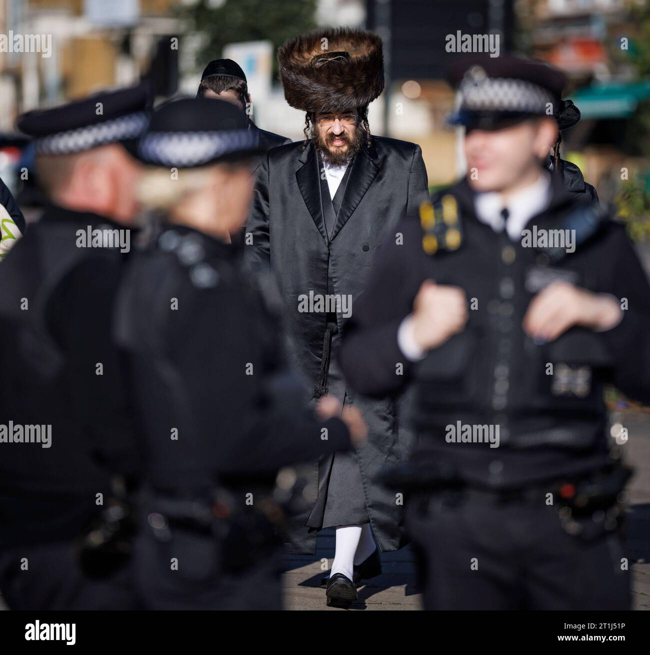 London, UK. 14th Oct, 2023. Police officers patrol as members of the ...