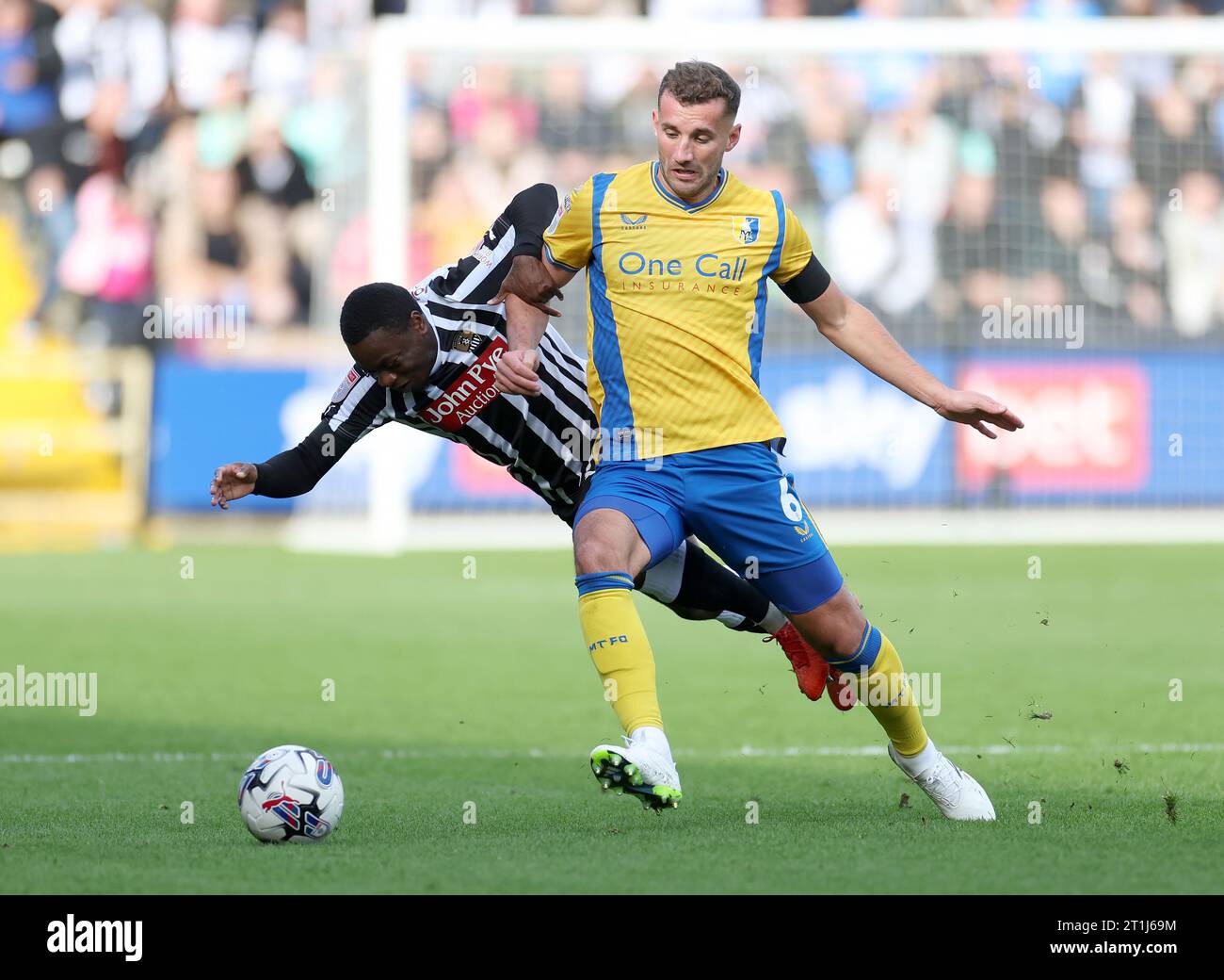 Mansfield Town’s Bailey Cargill (right) tackles Notts County’s Aaron ...