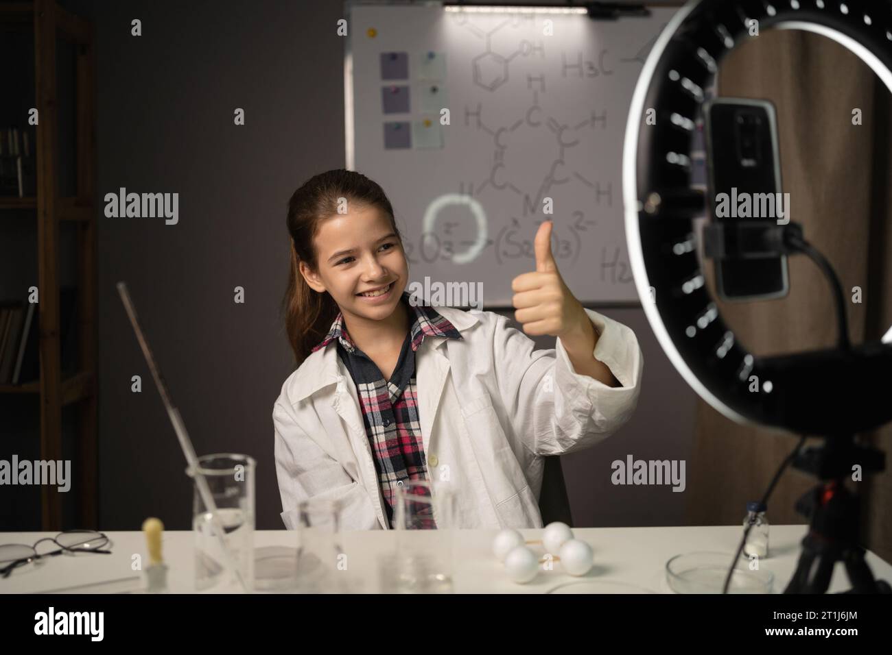 Science student girl recording learning blog talking to camera of ...