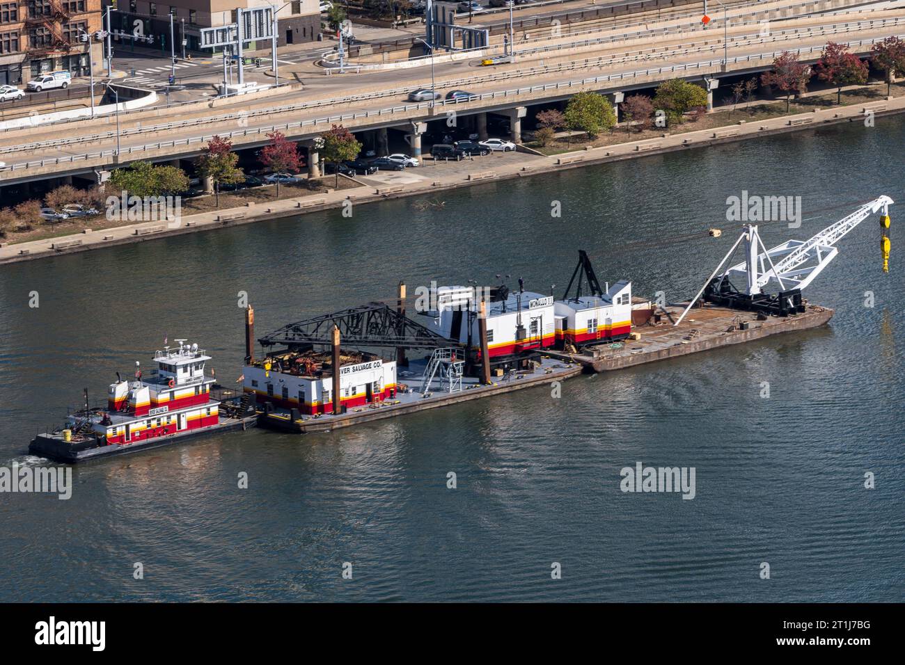 A tugboat pushing a nautical salvage barge on the Monongahela River in ...