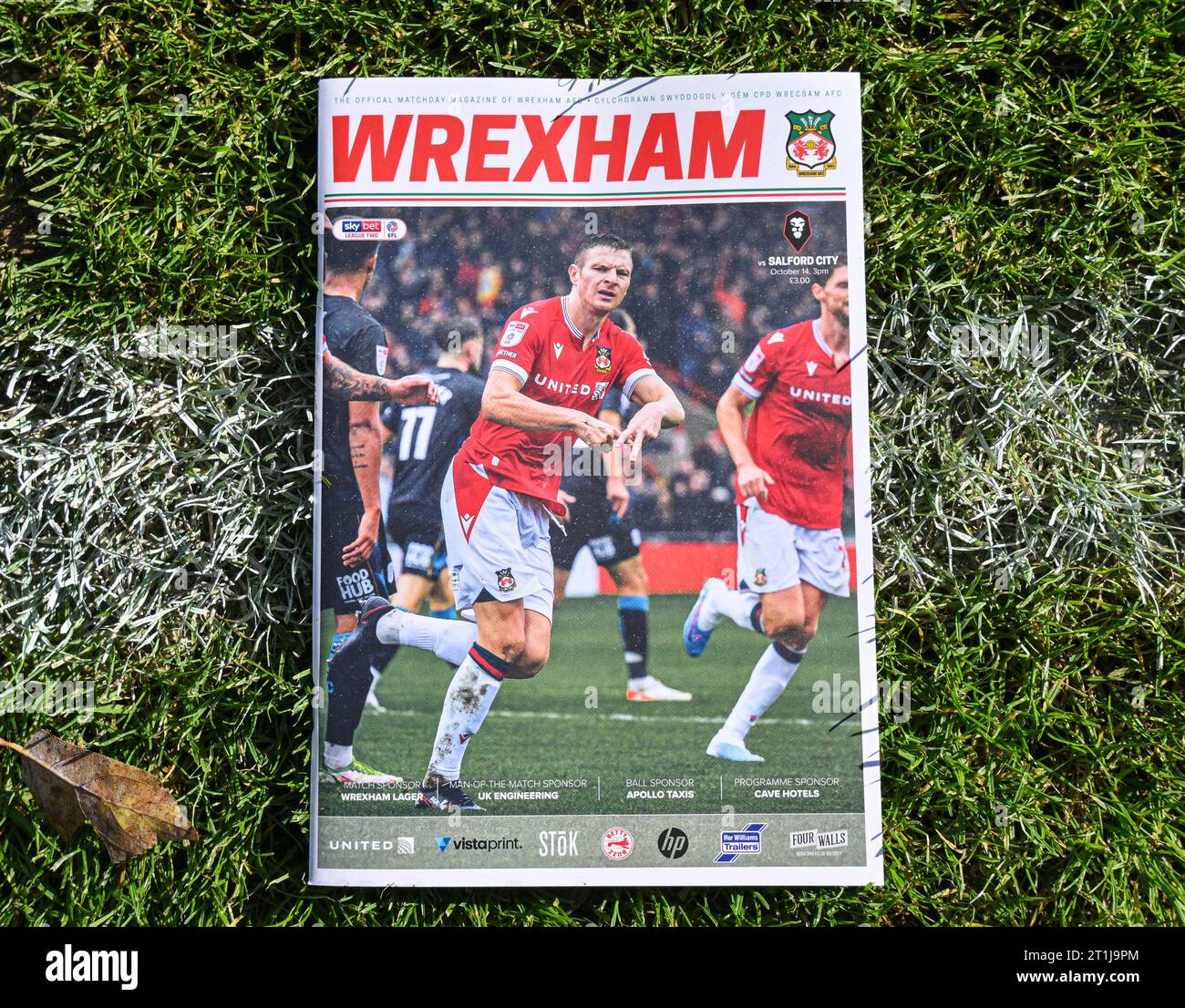 Wrexham, UK. 14th Oct, 2023. Match day program sits pitch side ahead of ...
