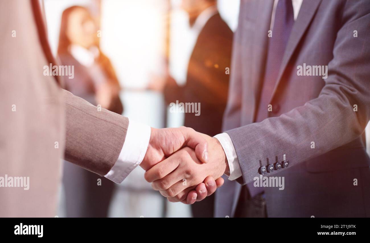 Business partners handshaking close hi-res stock photography and images ...