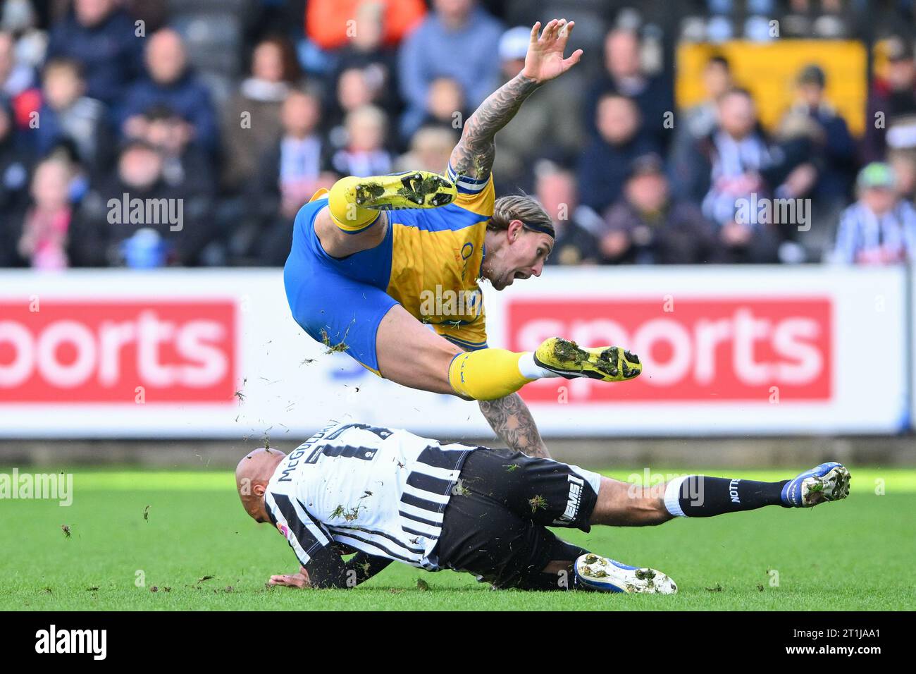 David McGoldrick of Notts County fouls Aden Flint of Mansfield Town ...
