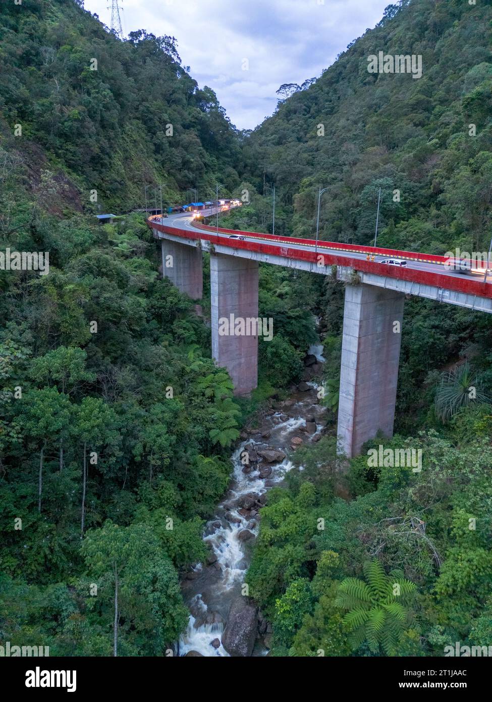 Aerial view of Kelok 9 bridge at dusk. A popular bridge in Sumatra to ...