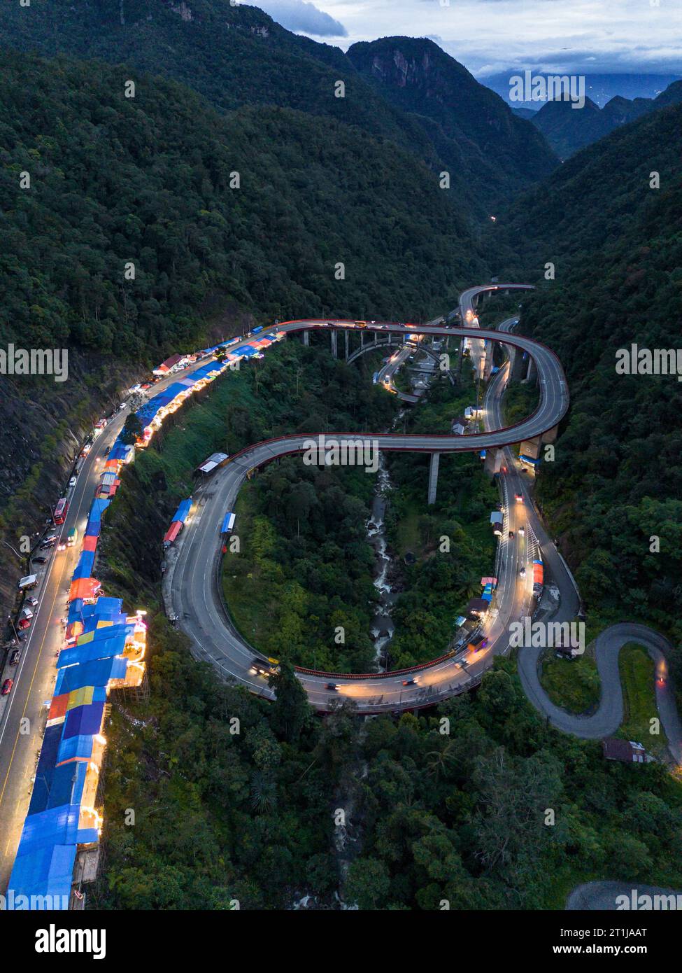 Aerial view of Kelok 9 bridge at dusk. A popular bridge in Sumatra to ...