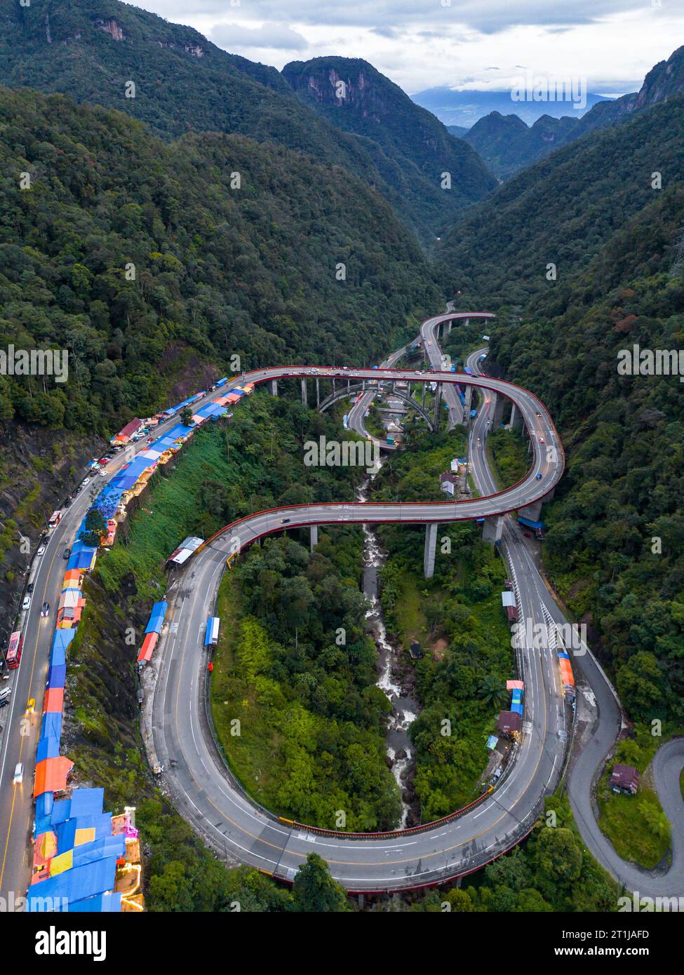 Aerial view of Kelok 9 bridge at dusk. A popular bridge in Sumatra to ...