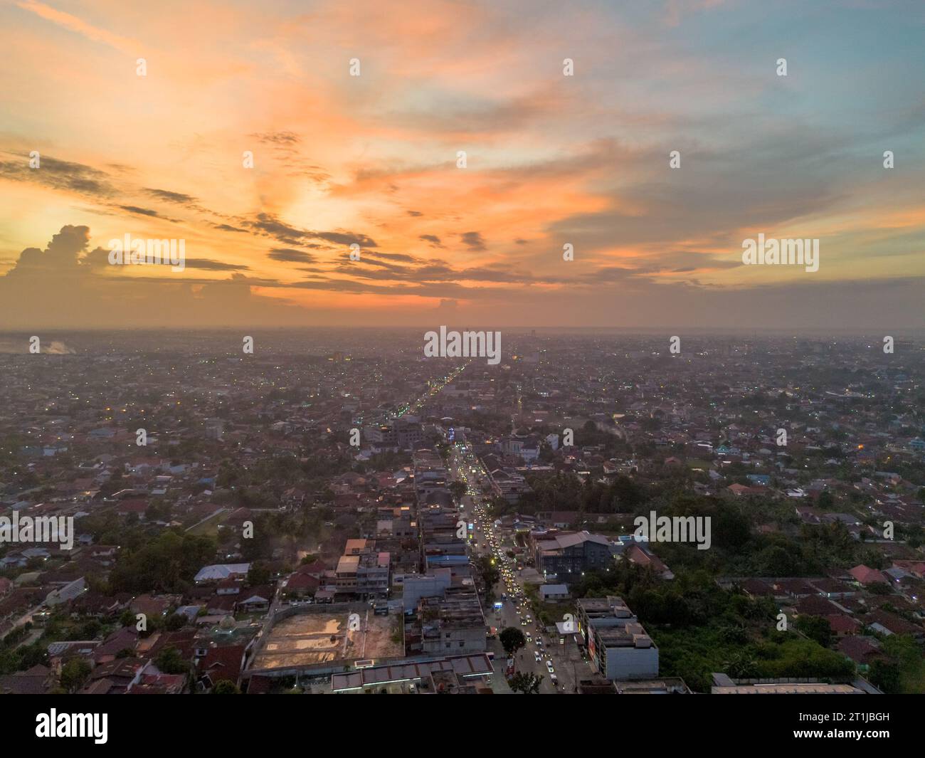 Aerial view of Pekanbaru city skyline during sunset. Capital city of ...