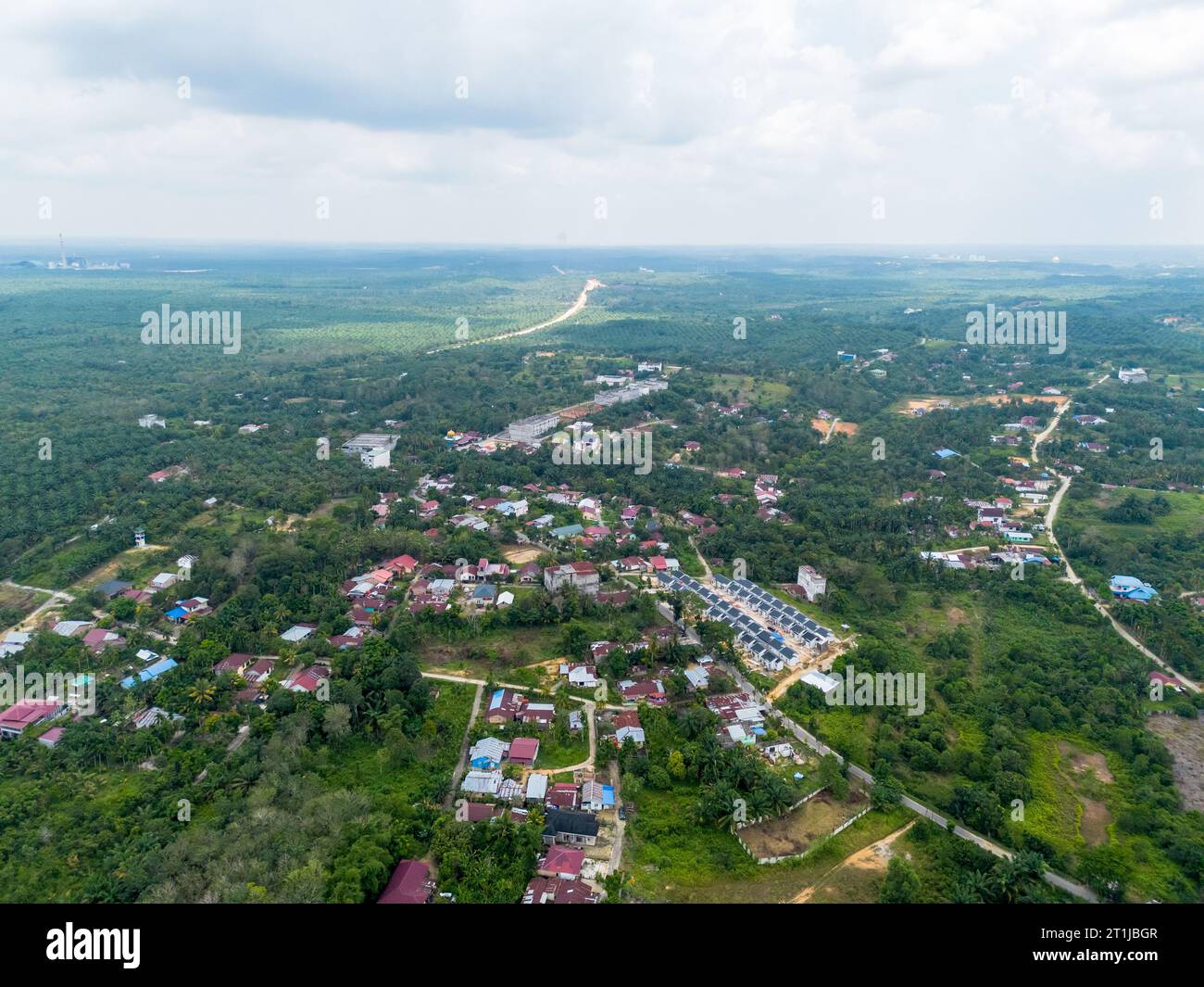 Aerial View of Pekanbaru city skyline with many trees in Indonesia. The ...