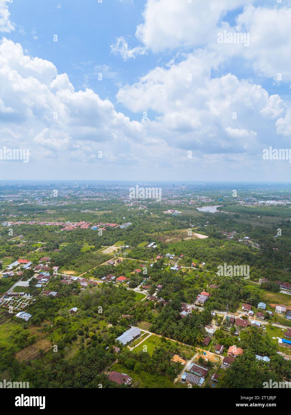 Aerial View of Pekanbaru city skyline with many trees in Indonesia. The ...