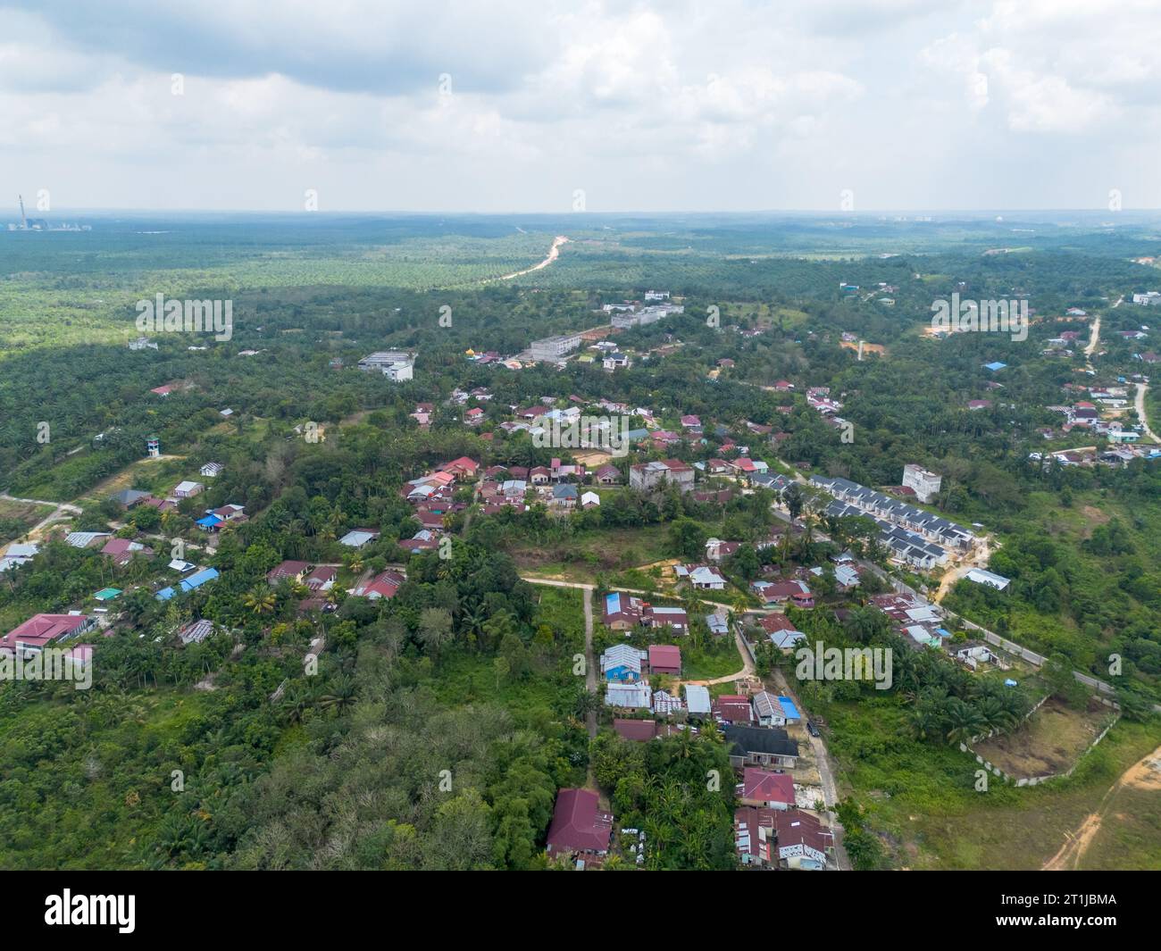 Aerial View of Pekanbaru city skyline with many trees in Indonesia. The ...