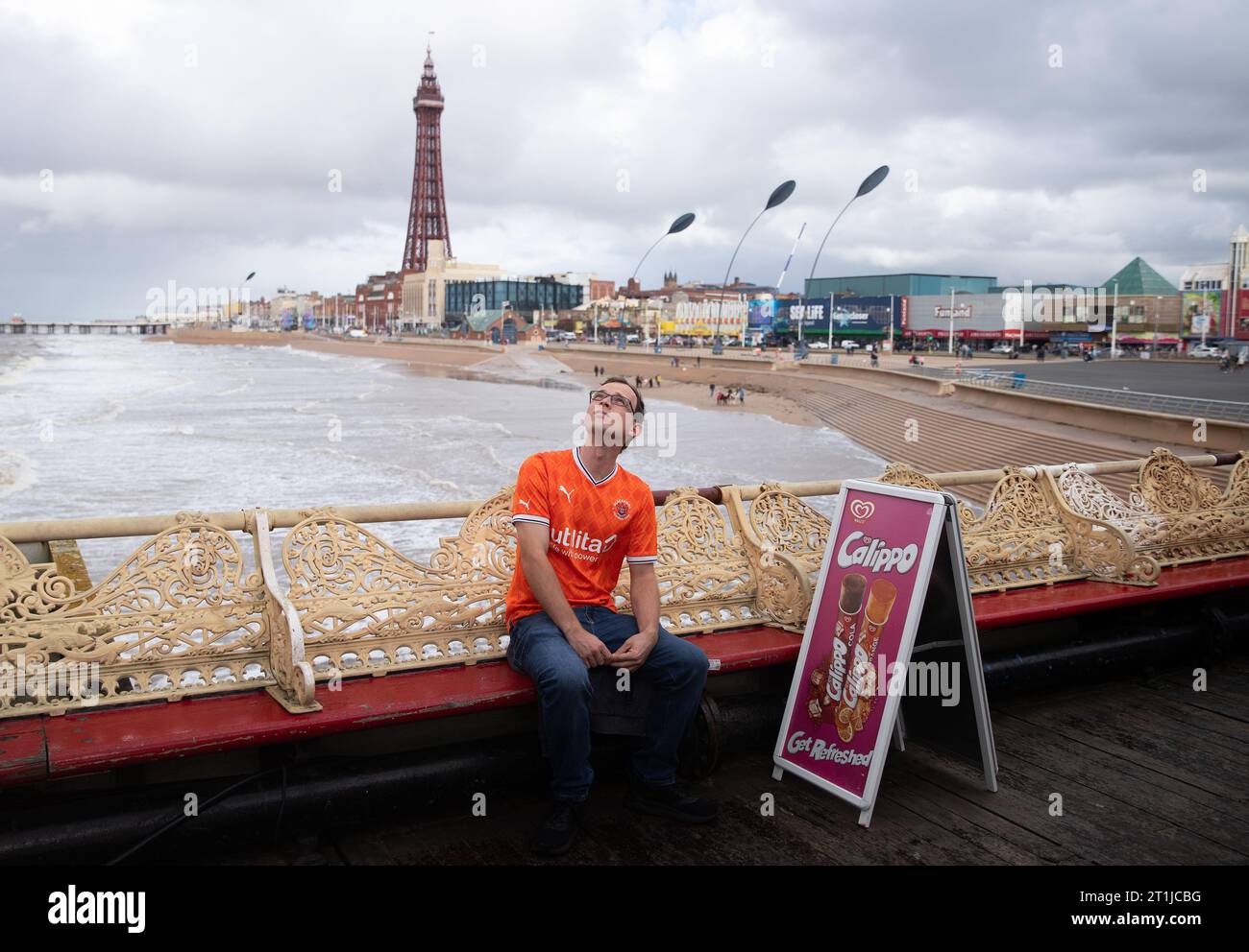 A Blackpool fan on central pier in front of Blackpool Tower ahead of ...