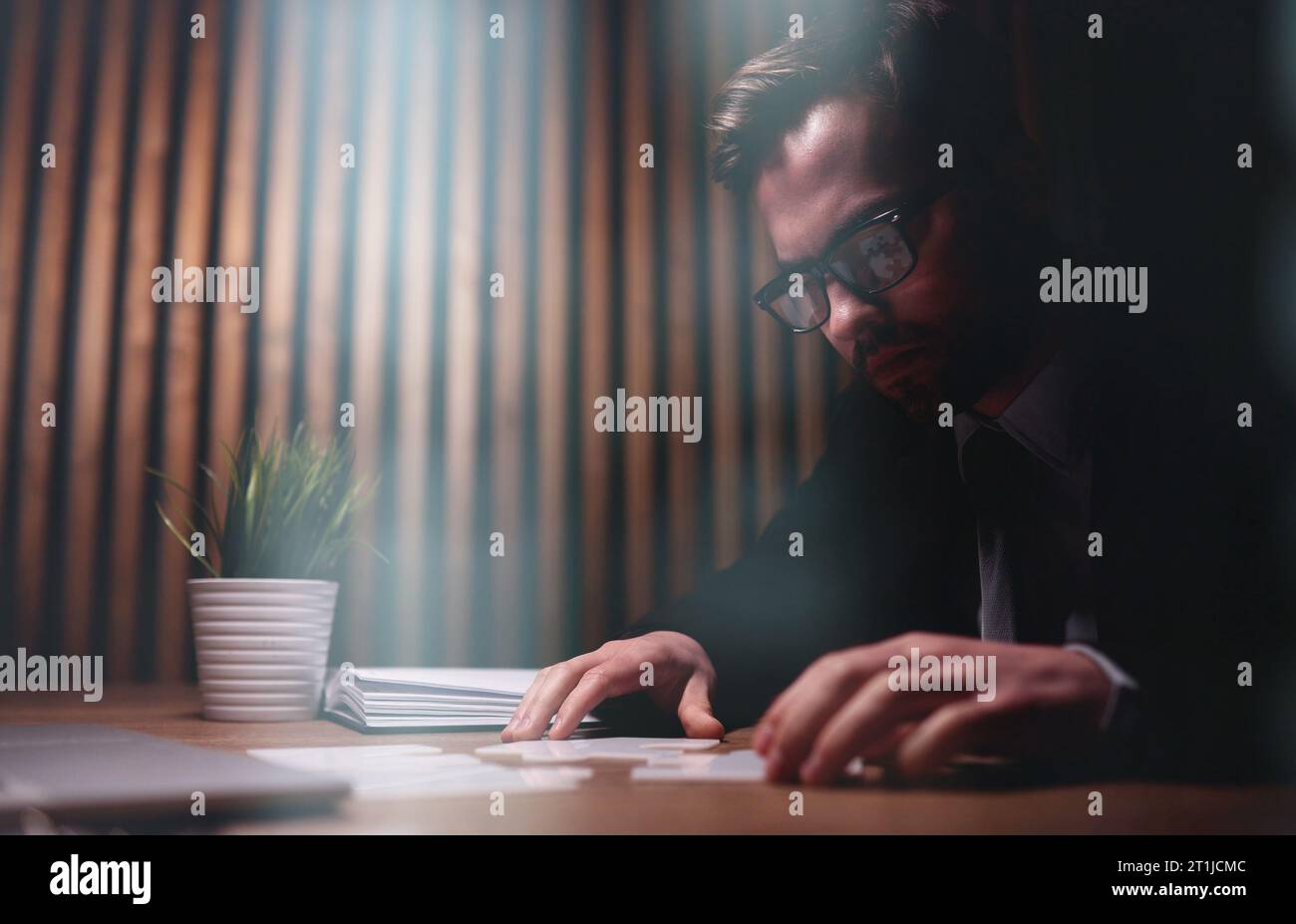 Attractive young guy is solving a problem Stock Photo - Alamy