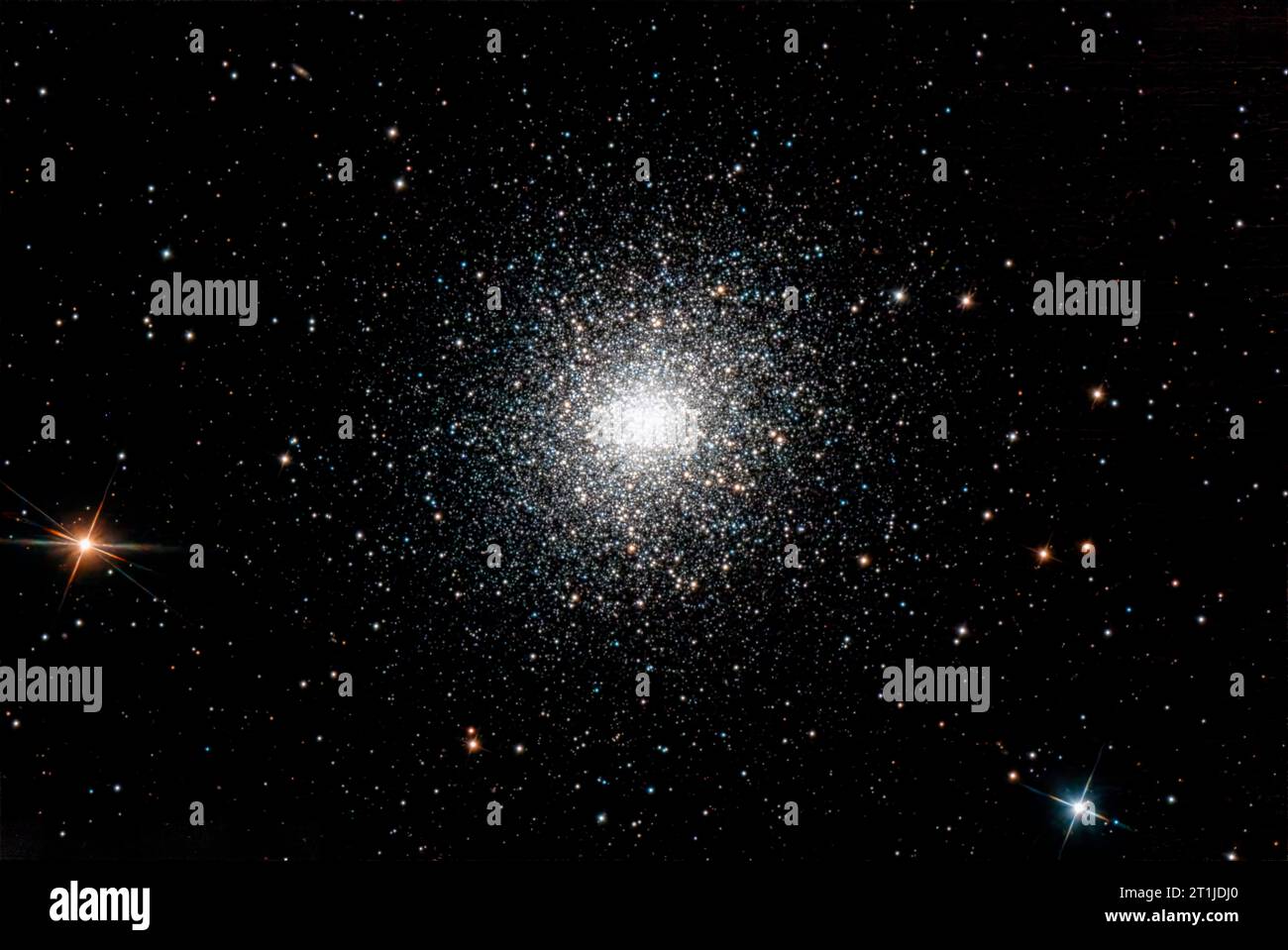 The Great Globular Cluster (Messier 13) in constellation Hercules. Also visible is the spiral ...