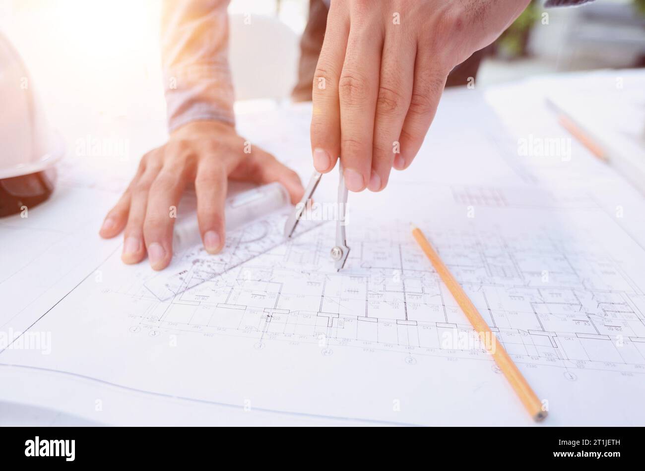 designer drawing graphic design of building project, improvement at ...