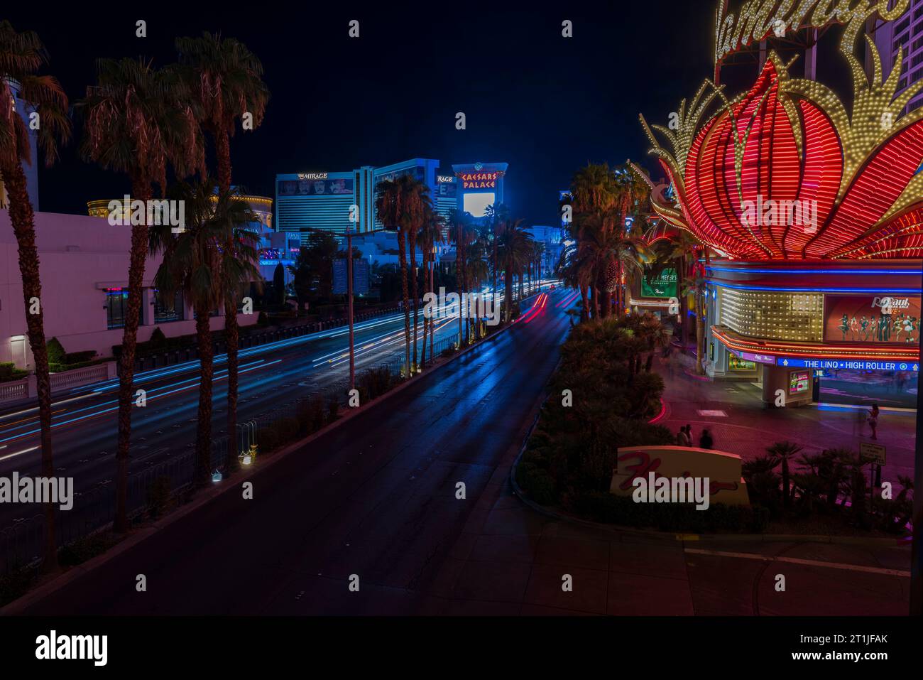 Night view of Las Vegas cityscape with gorgeous defocused light tracers of cars on Strip Road ...