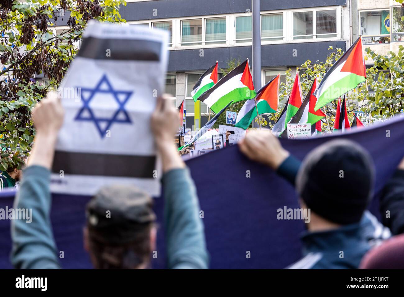 Duesseldorf, Germany. 14th Oct, 2023. A pro-Israel counter-demonstrator ...