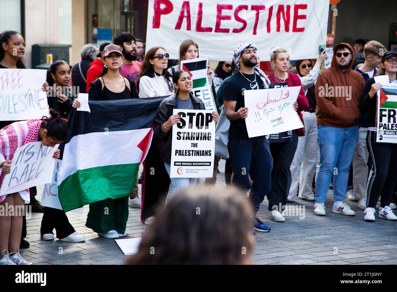 Free Palestine protest Exeter city centre - group of protestors hold ...